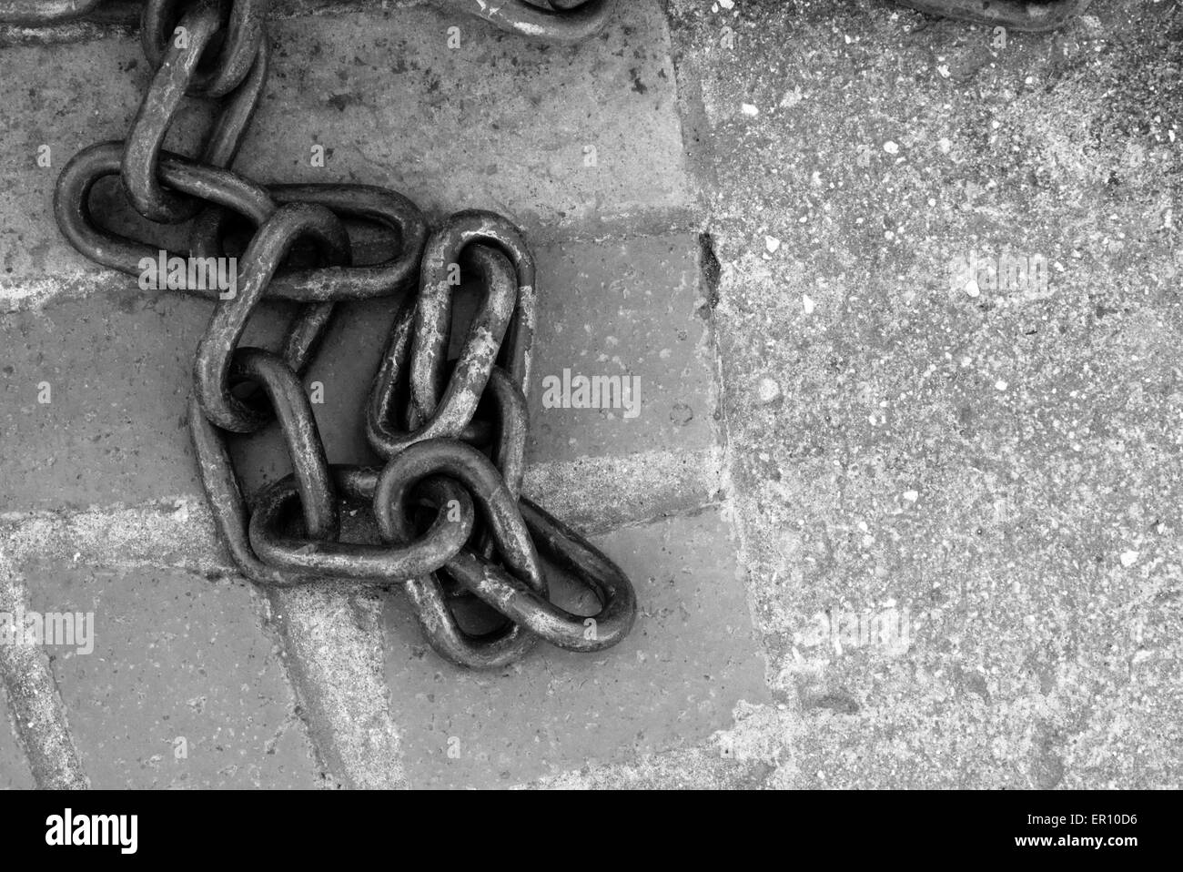Black and white image of large-linked chain on the ground Stock Photo ...