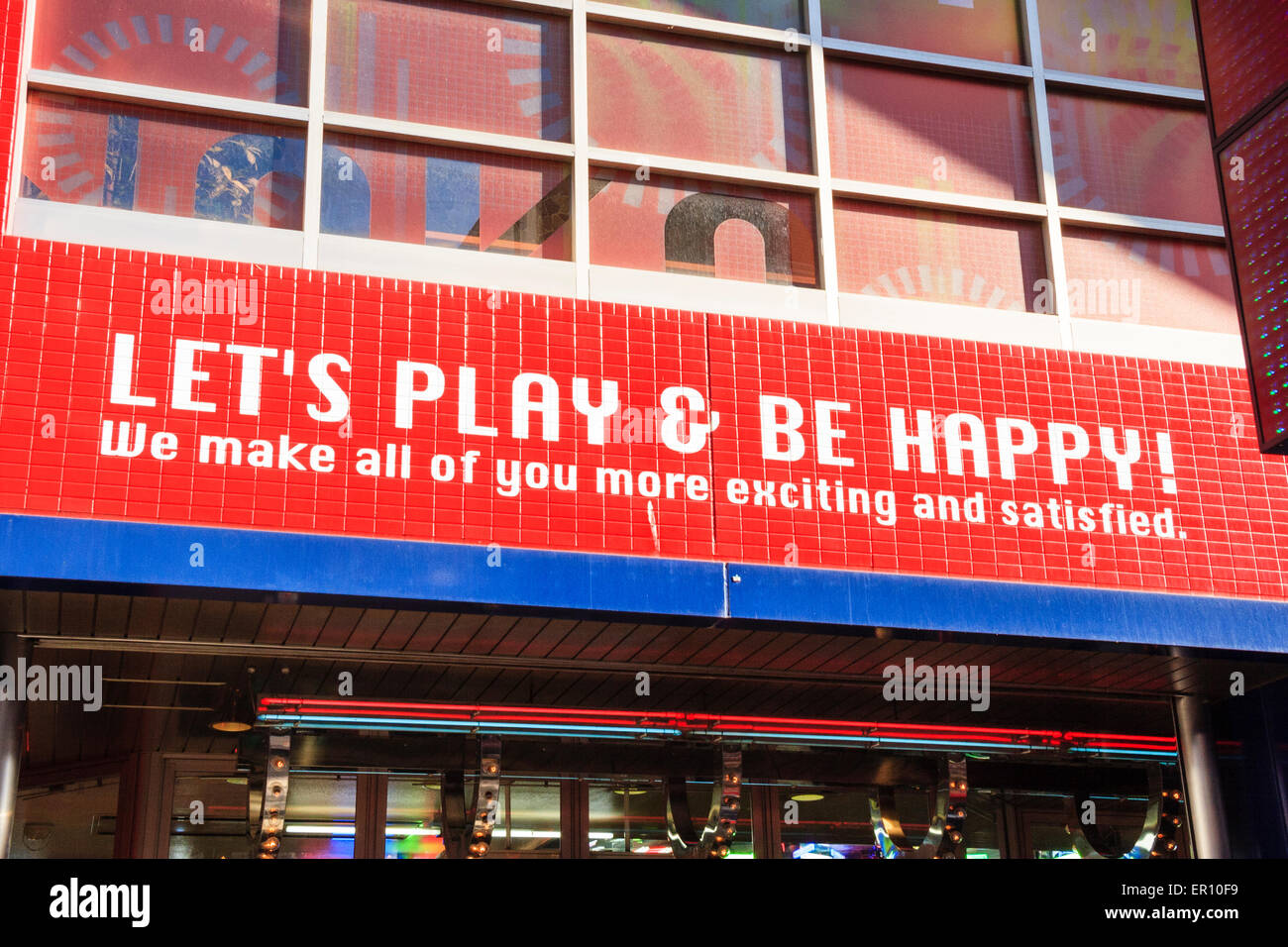 Japan. Red sign above toy store with good example of Japenlish "Let's ...