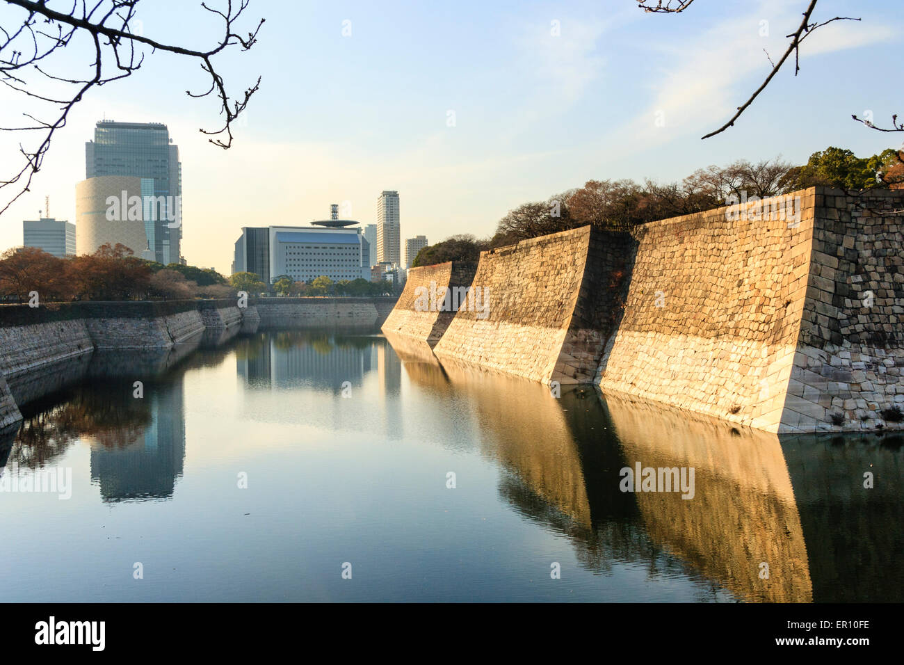 Osaka castle. View along high zig-zagging ishigaki stone walls of the ...