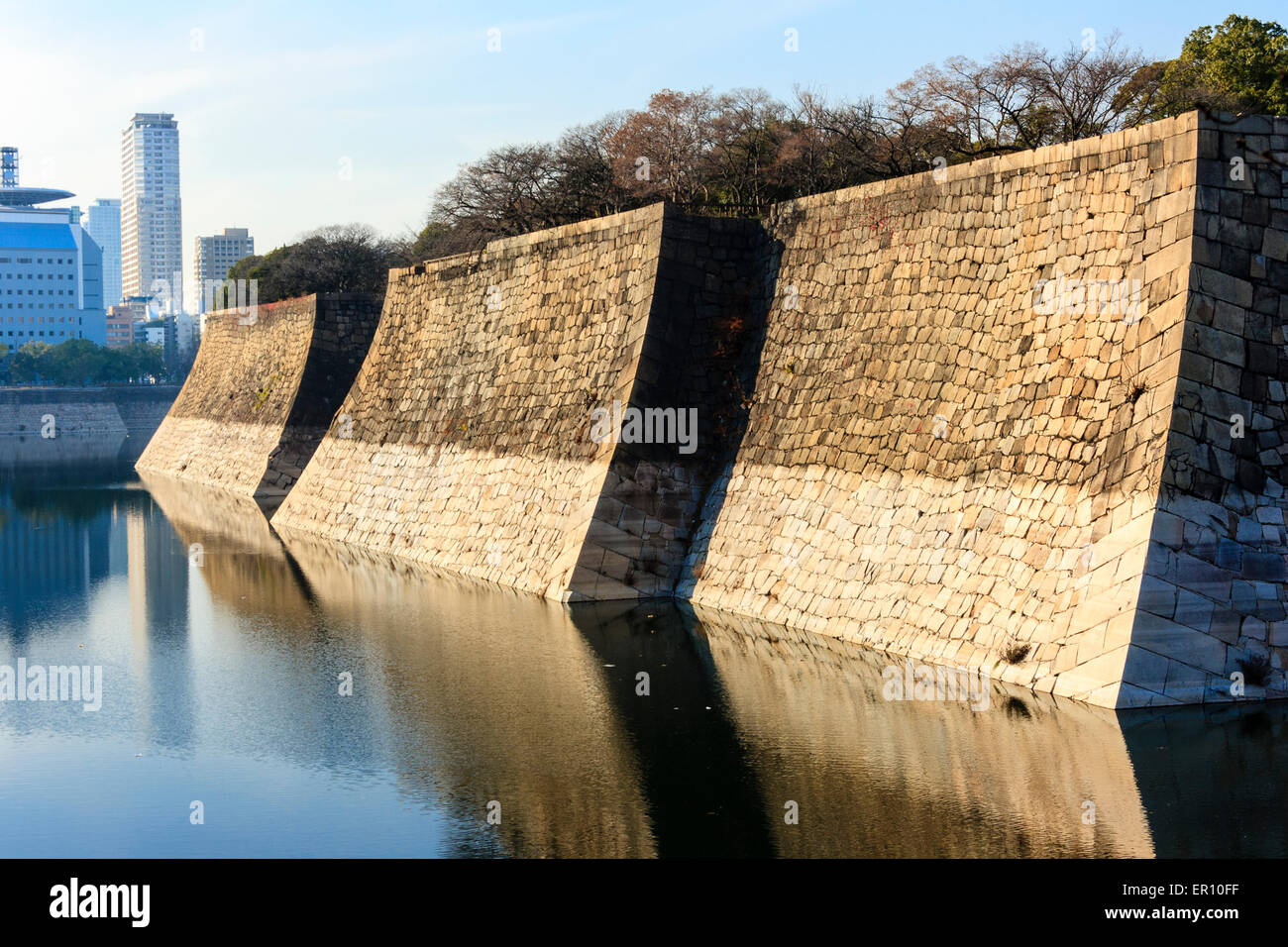 Osaka castle. View along high zig-zagging ishigaki stone walls of the ...