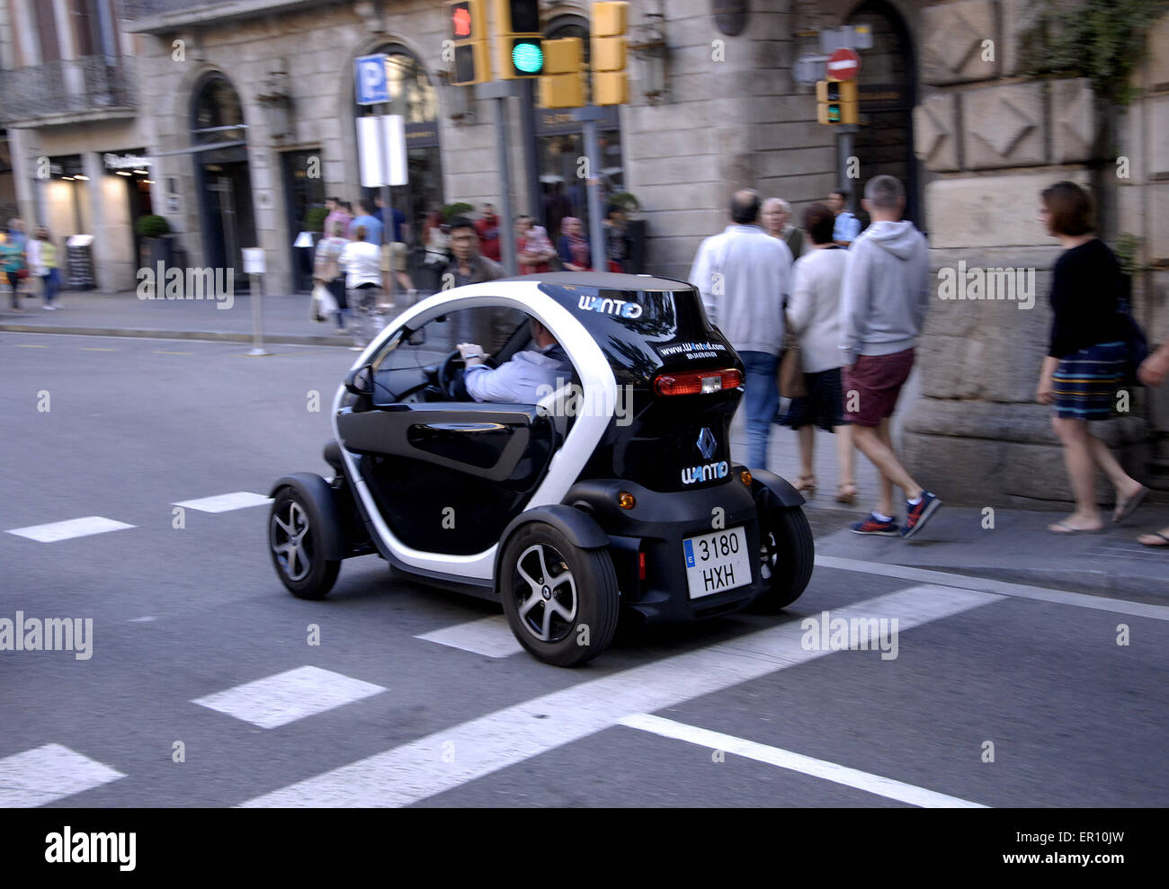 Barcelona, Spain. 24th May, 2015. Tourist couple driving world's ...