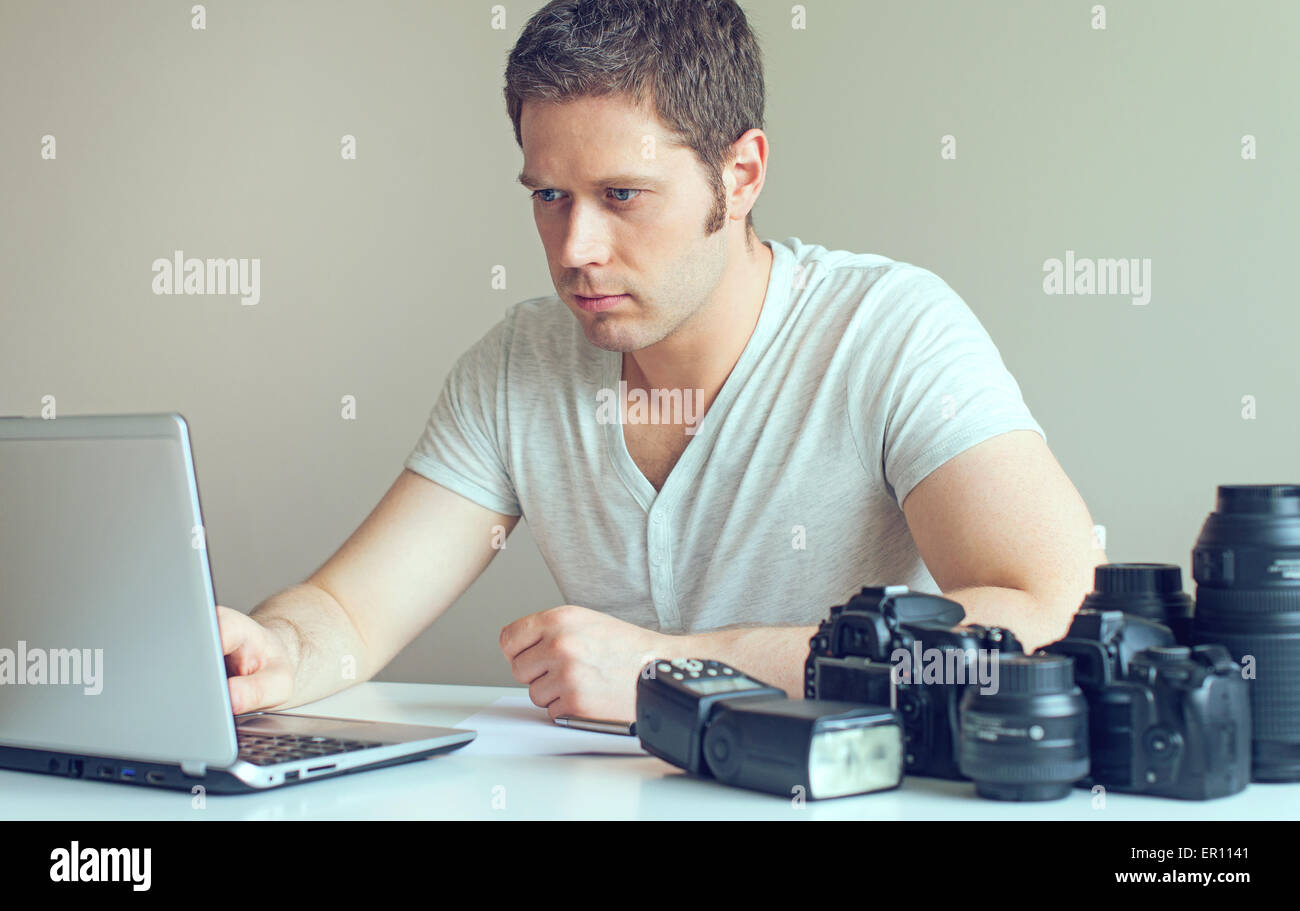 Photographer working in his office Stock Photo - Alamy