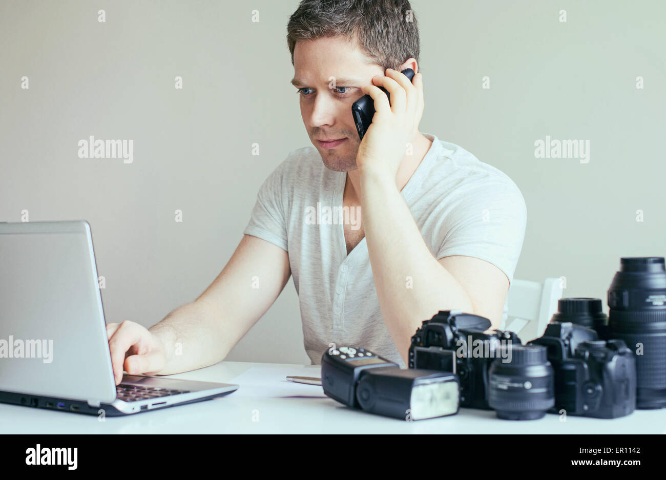 Photographer working in his office Stock Photo - Alamy