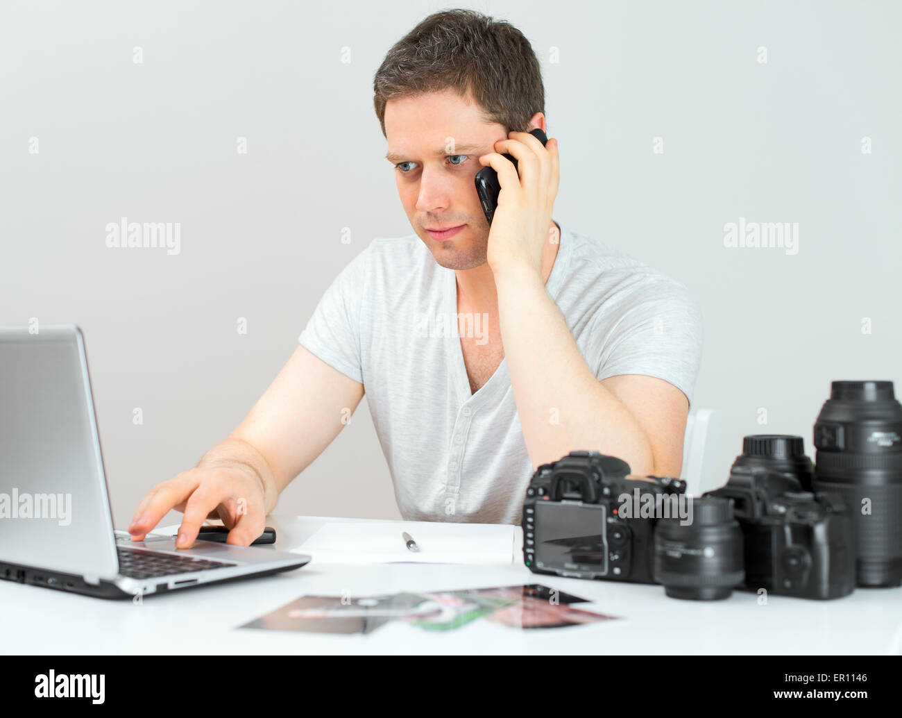 Photographer working in his office Stock Photo - Alamy