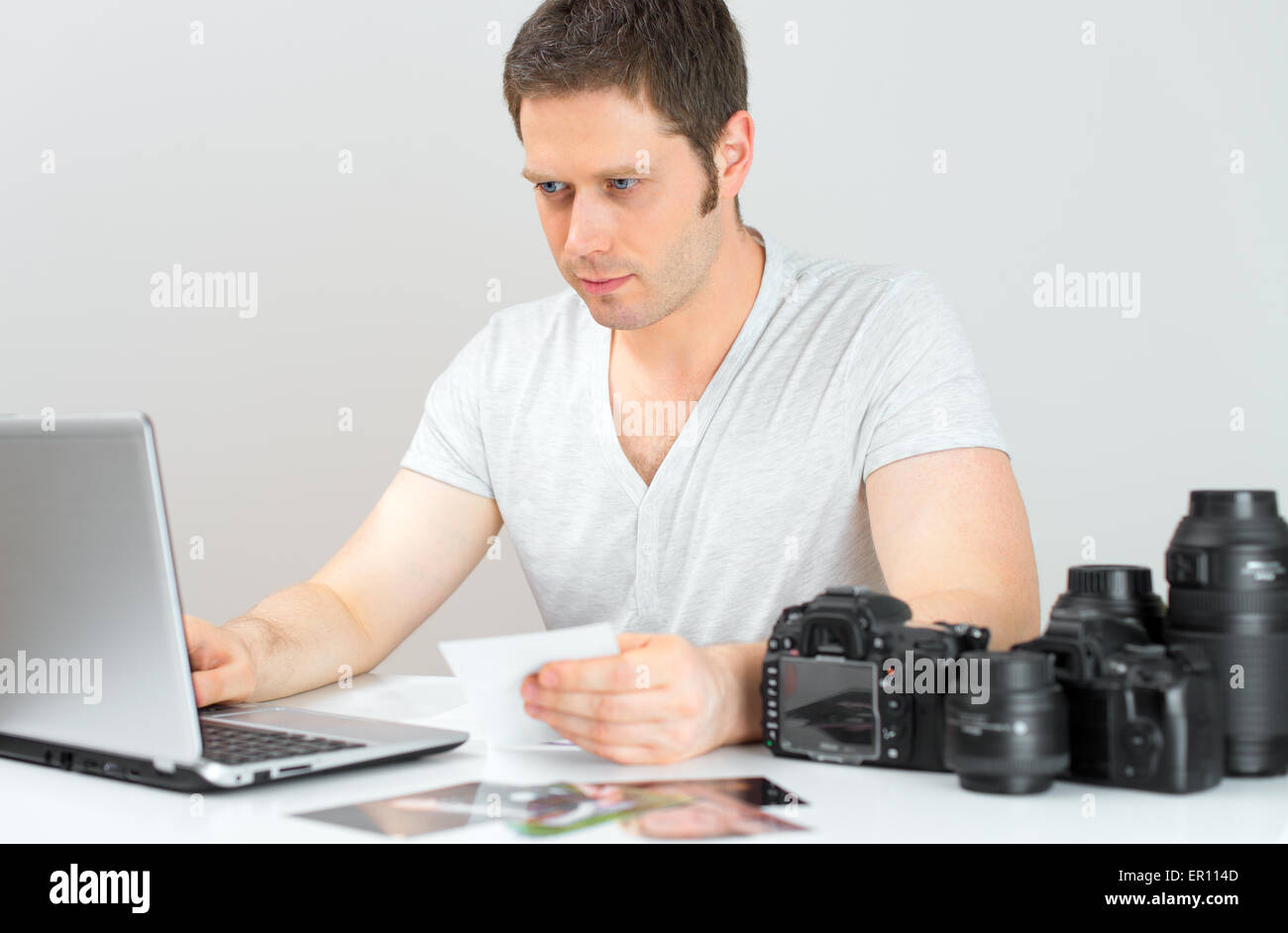 Photographer working in his office Stock Photo - Alamy