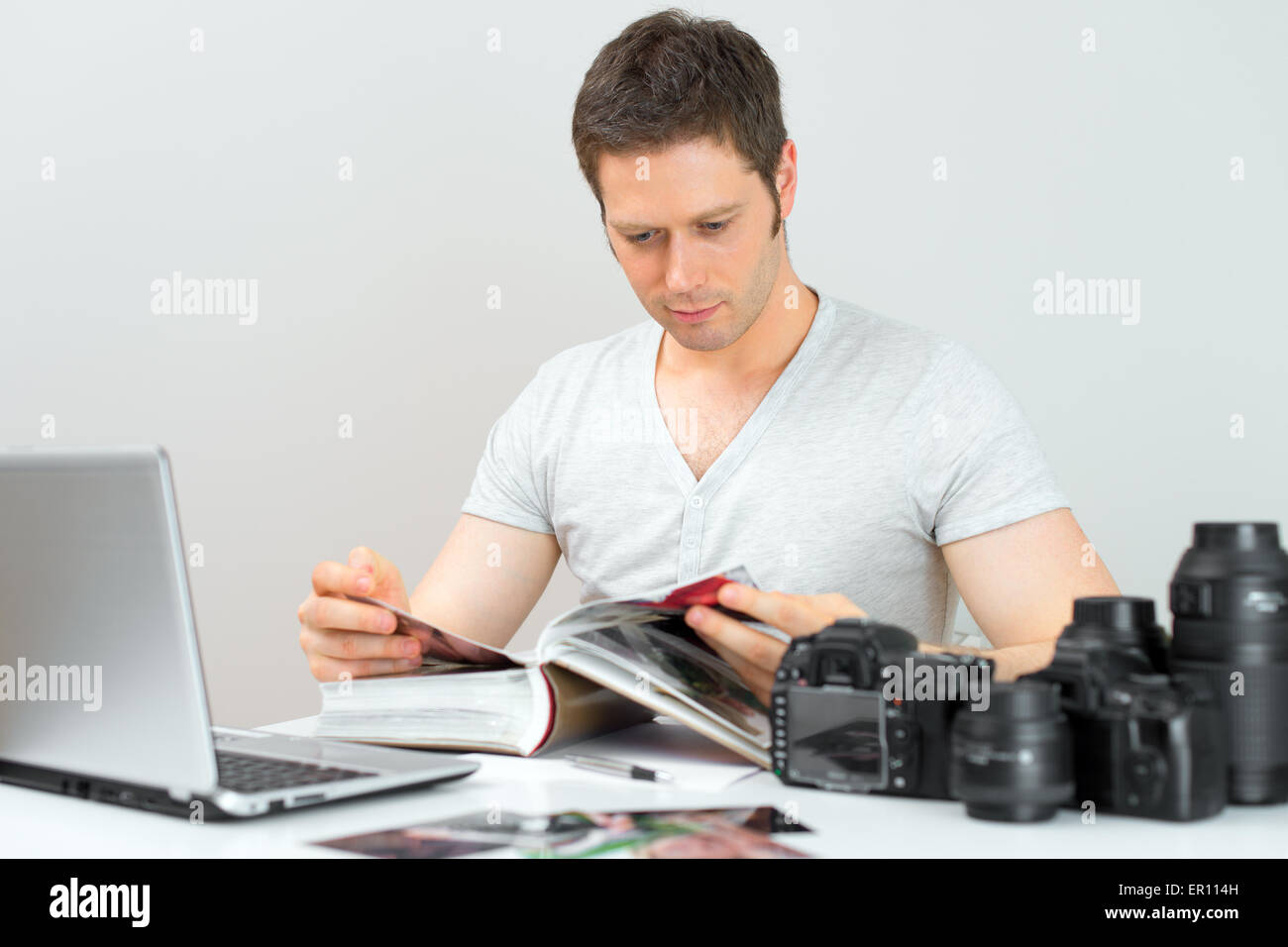 Photographer working in his office Stock Photo - Alamy