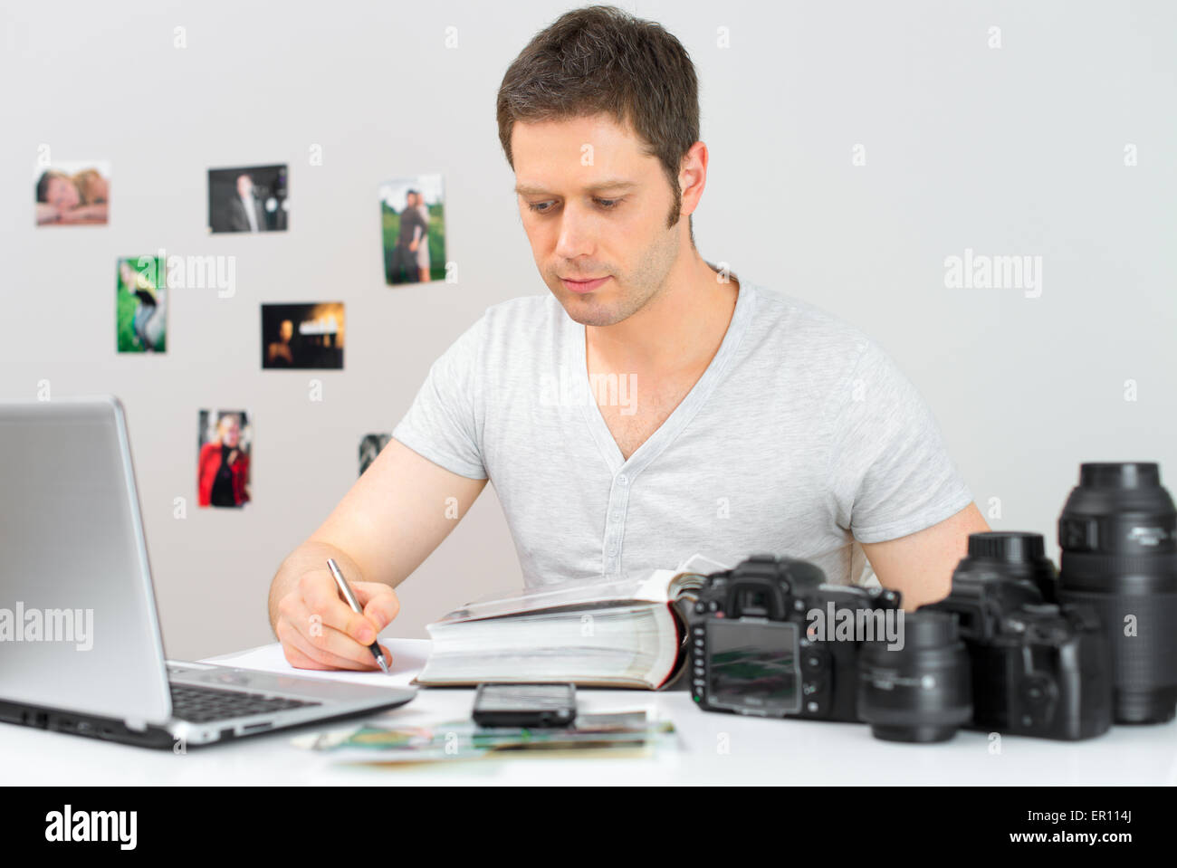 Photographer working in his office Stock Photo - Alamy