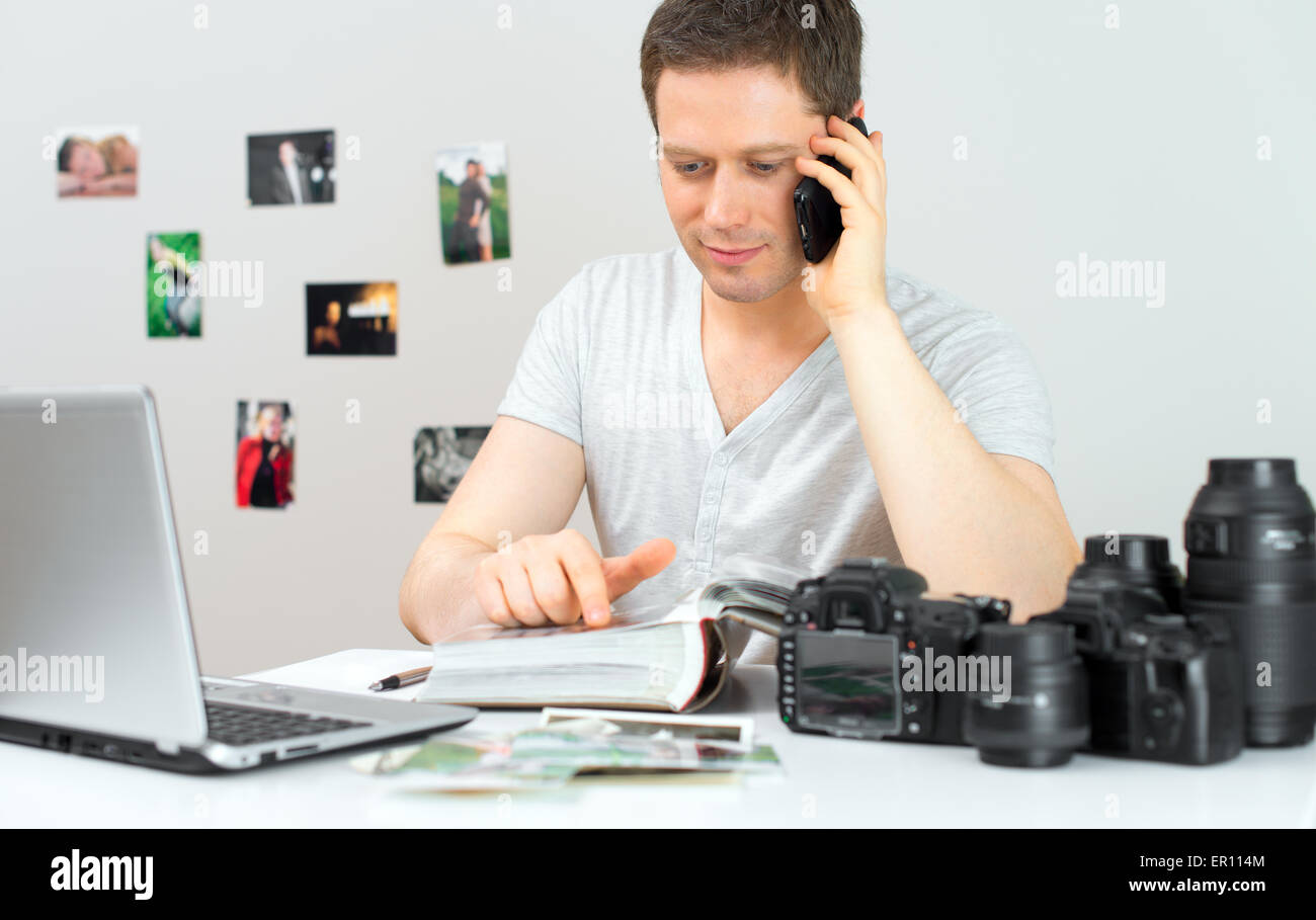 Photographer working in his office Stock Photo - Alamy