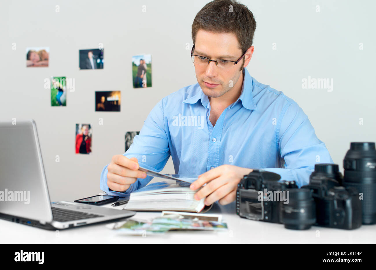Photographer working in his office Stock Photo - Alamy