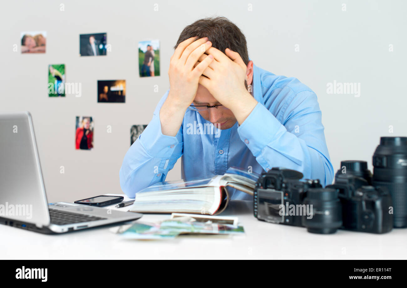 Photographer working in his office Stock Photo - Alamy