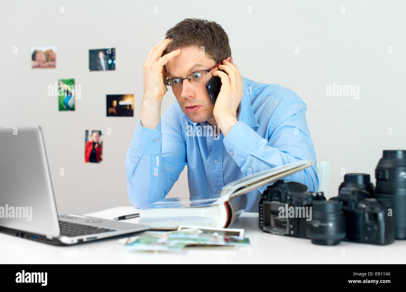 Photographer working in his office Stock Photo - Alamy