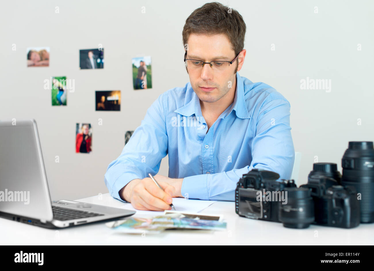 Photographer working in his office Stock Photo - Alamy