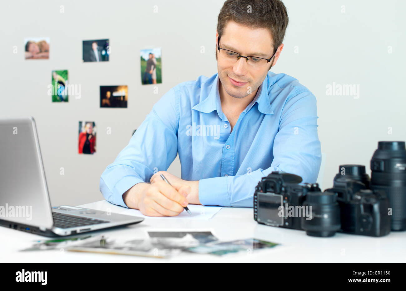 Photographer working in his office Stock Photo - Alamy