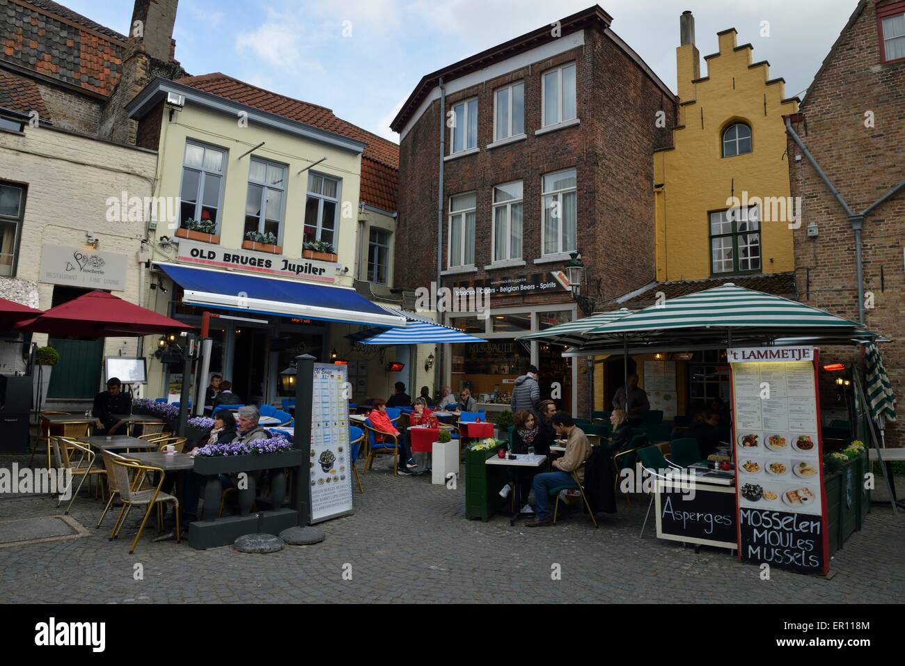 Tourist enjoying a meal in the town of Burges in Belgium, known as the ...