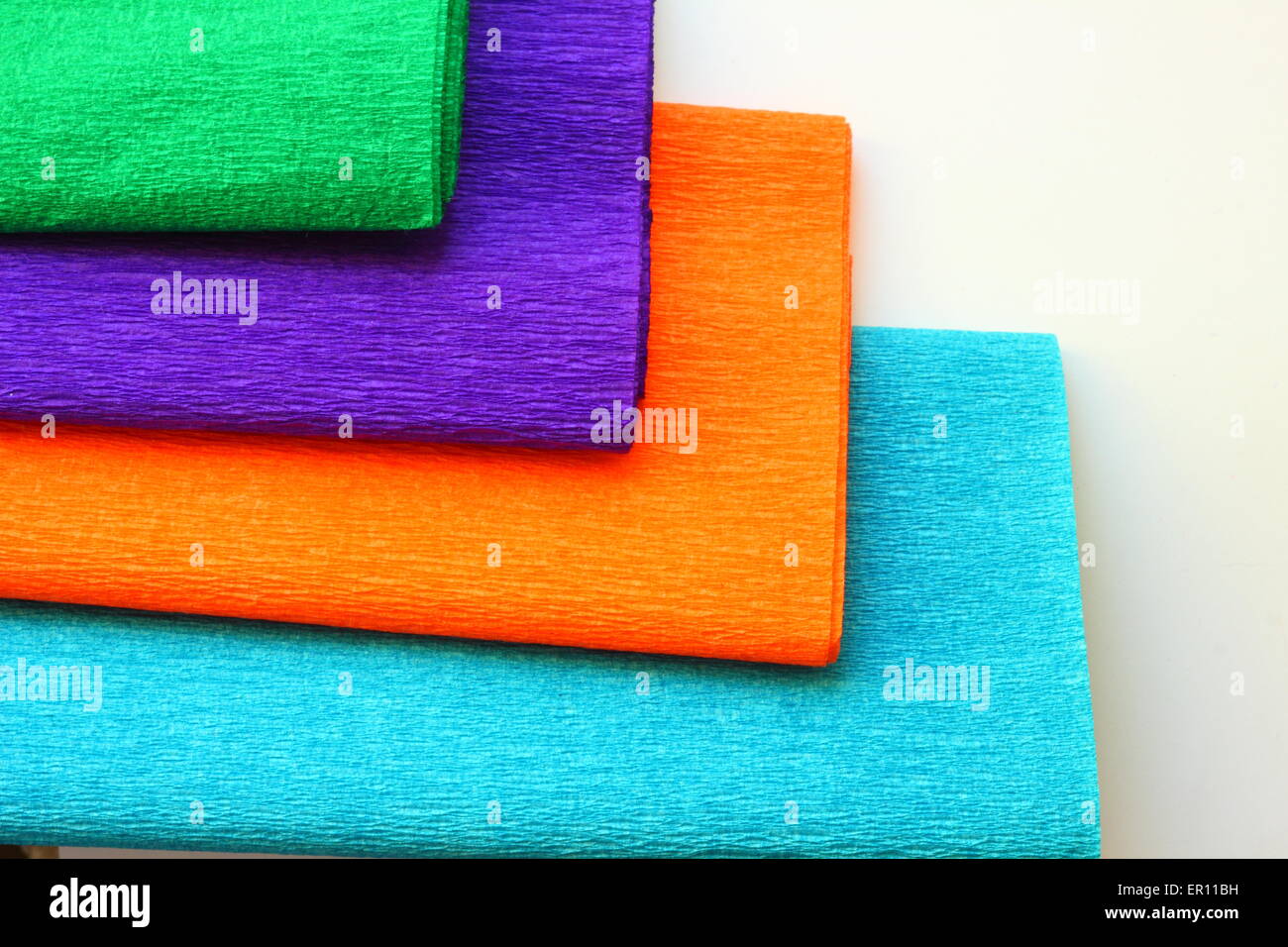 on a white background rolls of colored paper Stock Photo - Alamy