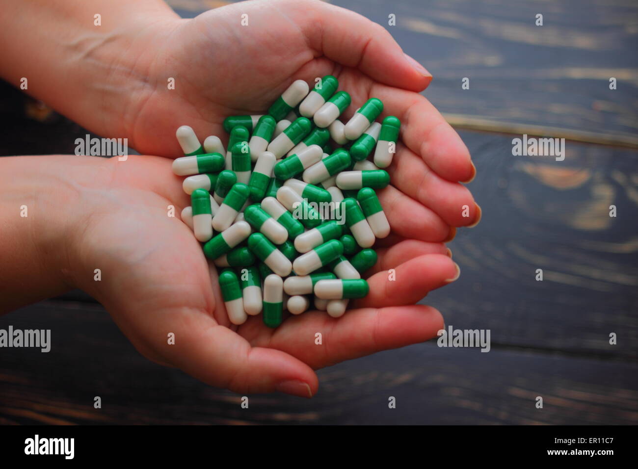 in the hands of a large number of capsules Stock Photo - Alamy