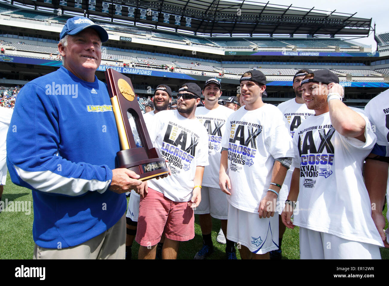 May 24, 2015: Limestone Saints head coach J.B. Clarke holds the trophy ...