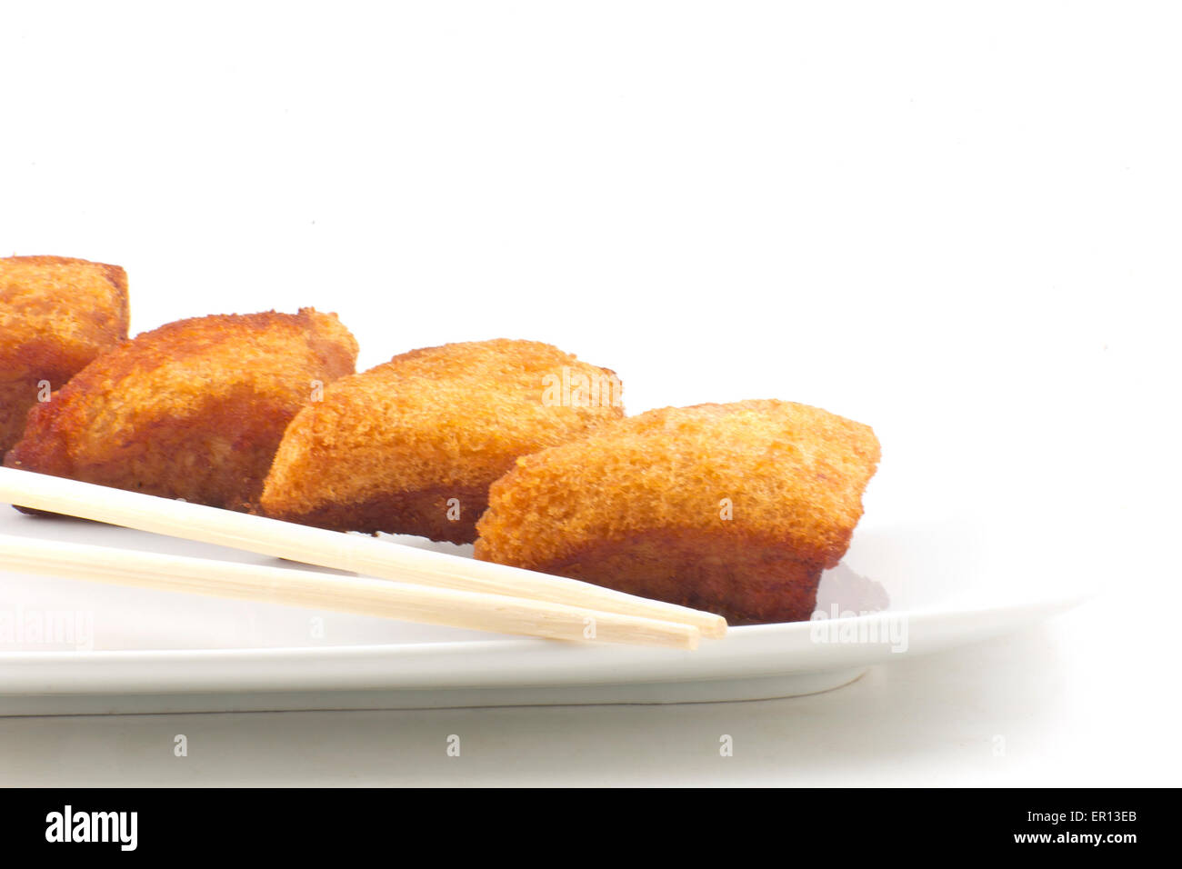 Chinese shrimp toast arranged simple and delightfully isolated on white ...