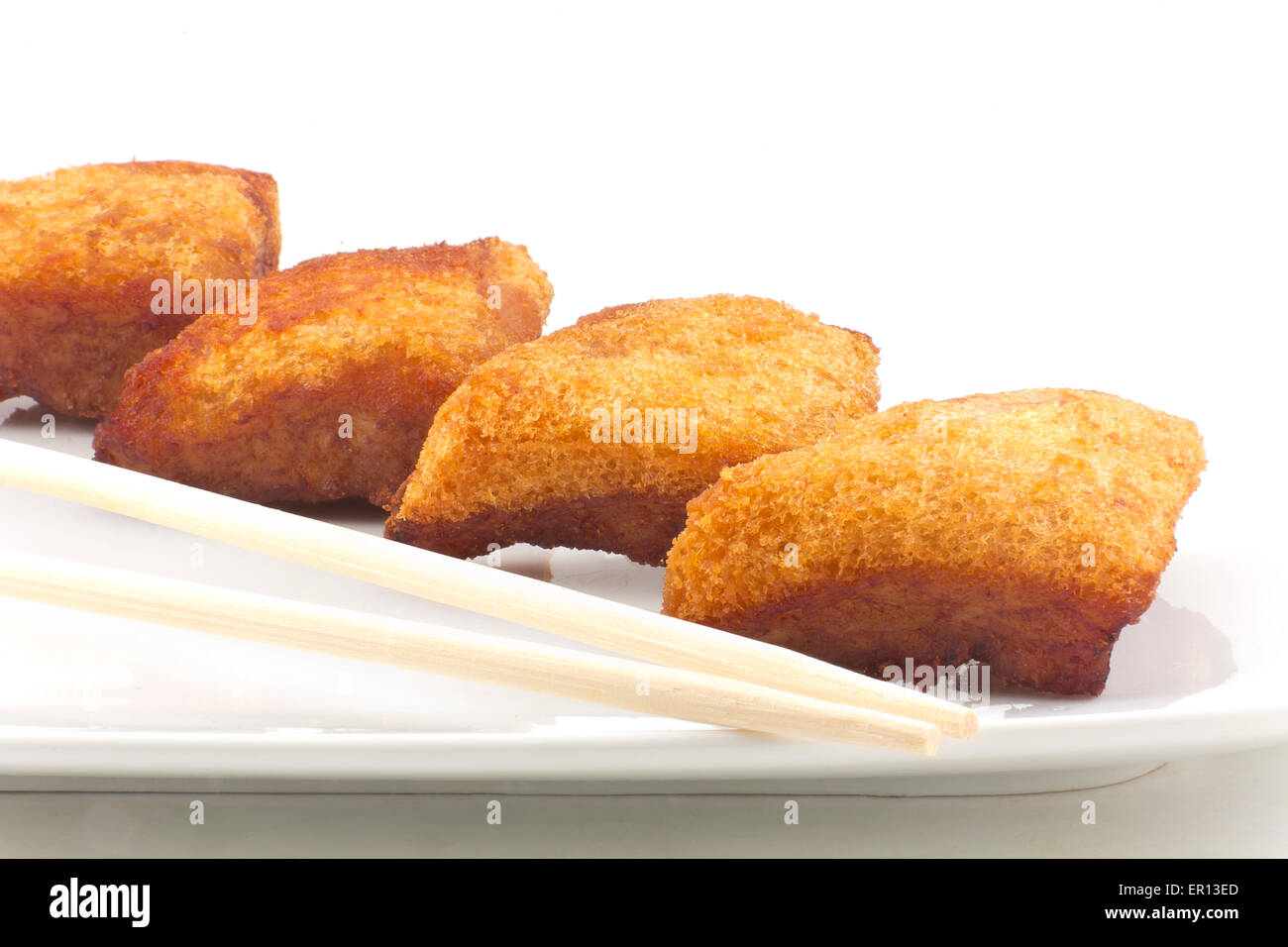 Chinese shrimp toast arranged simple and delightfully isolated on white ...