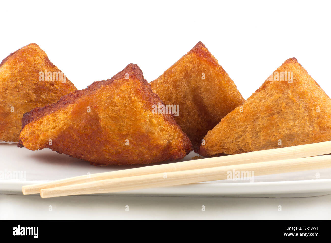 Chinese shrimp toast arranged simple and delightfully isolated on white ...