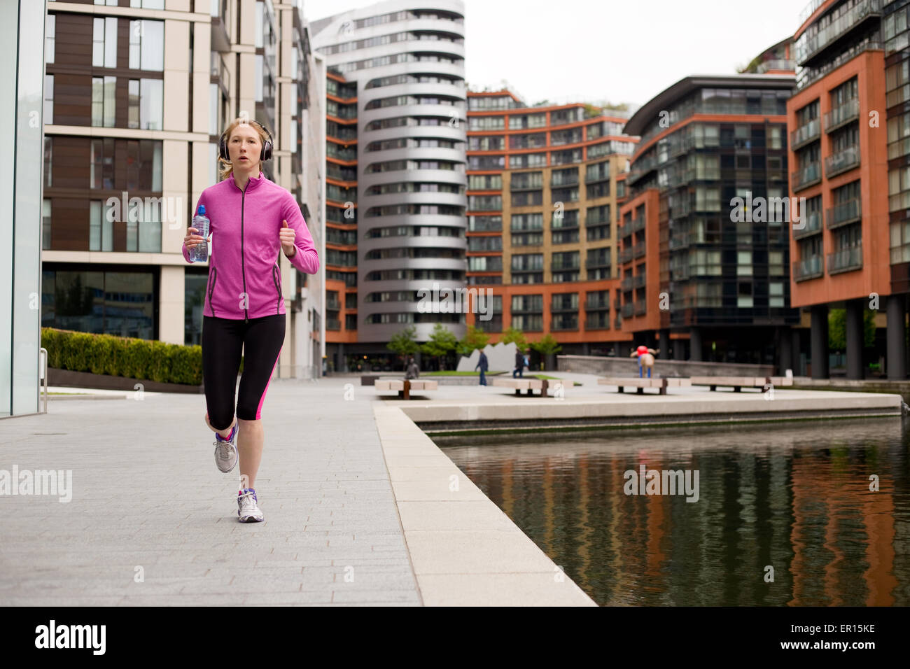 young woman running in the city Stock Photo - Alamy