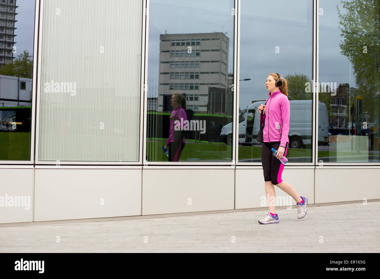 young woman walking to the gym Stock Photo - Alamy