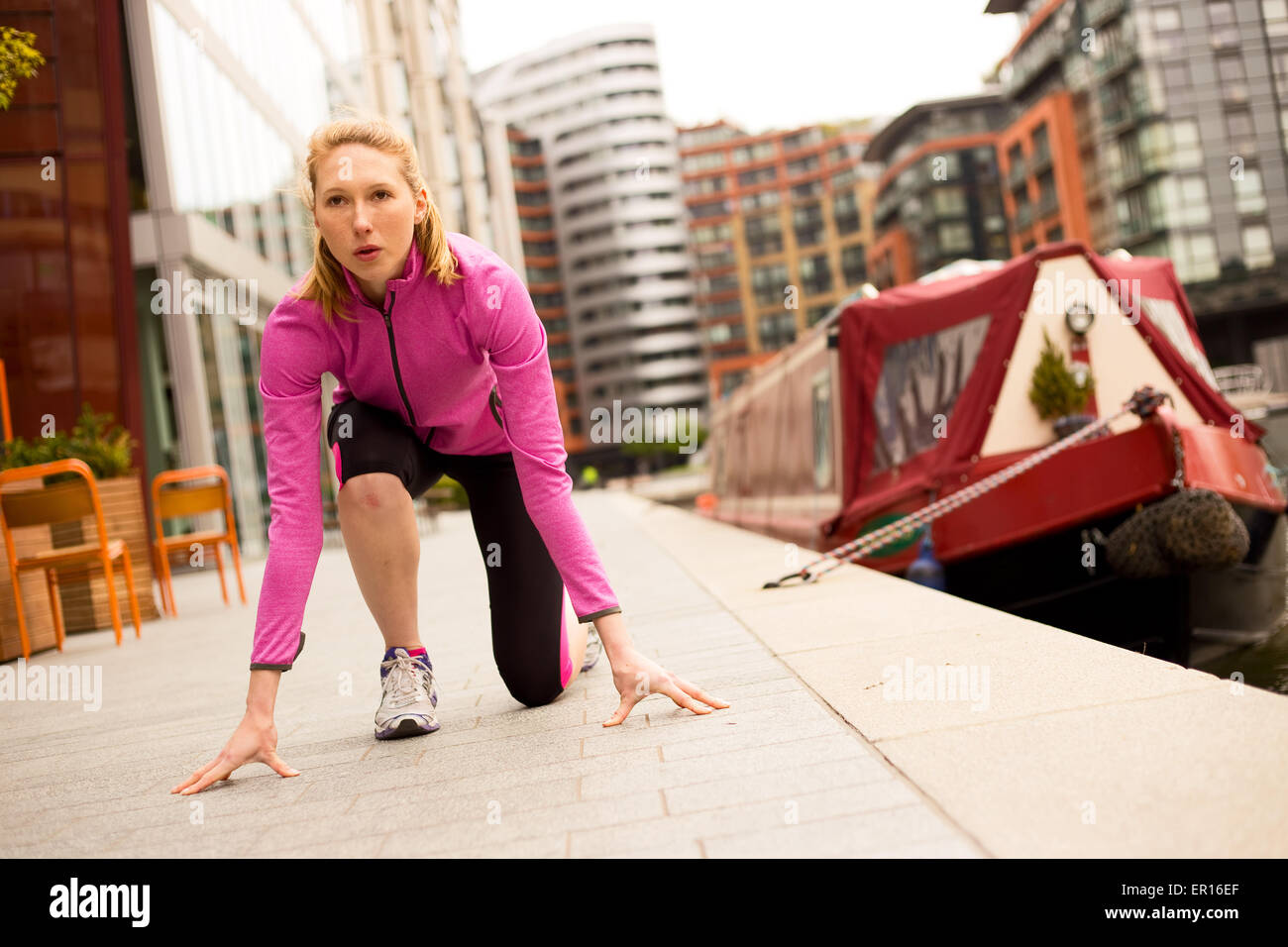 young woman preparing to run Stock Photo - Alamy