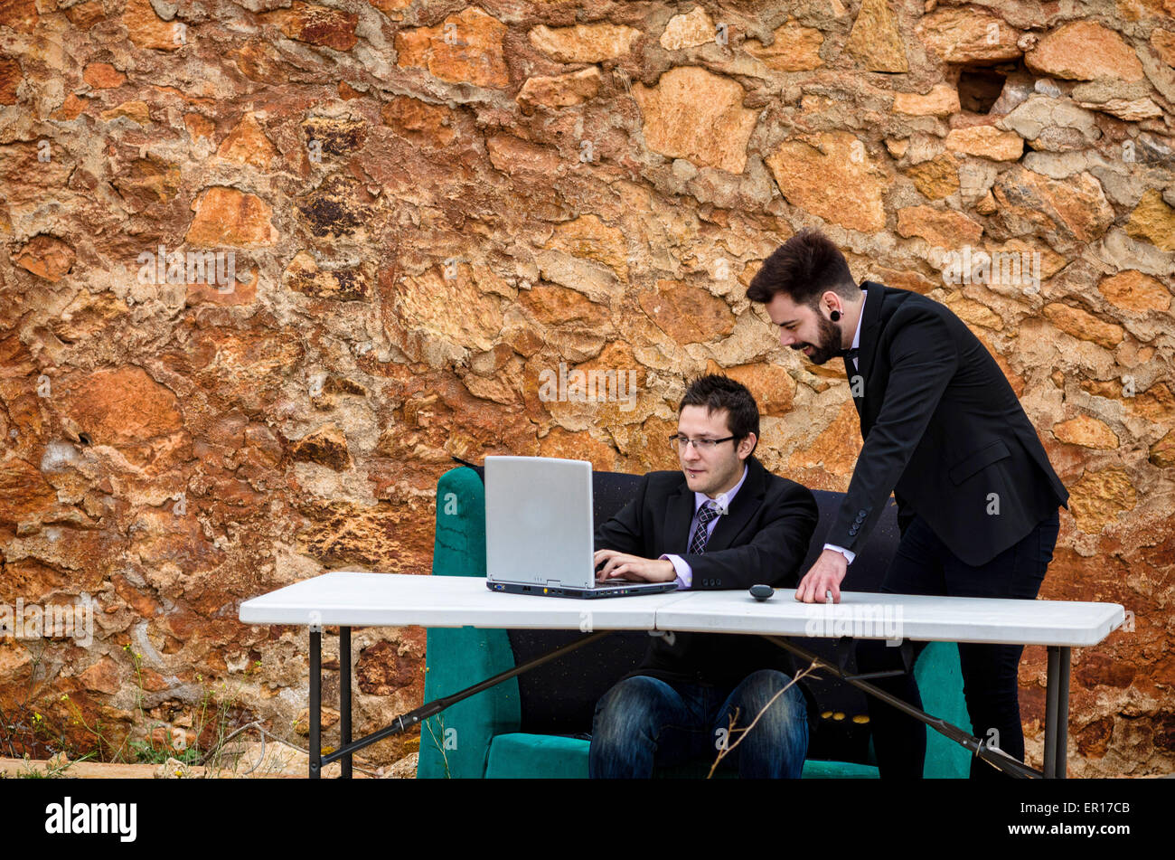 Two guys around a desk in a grunge office, a bankruptcy concept Stock ...
