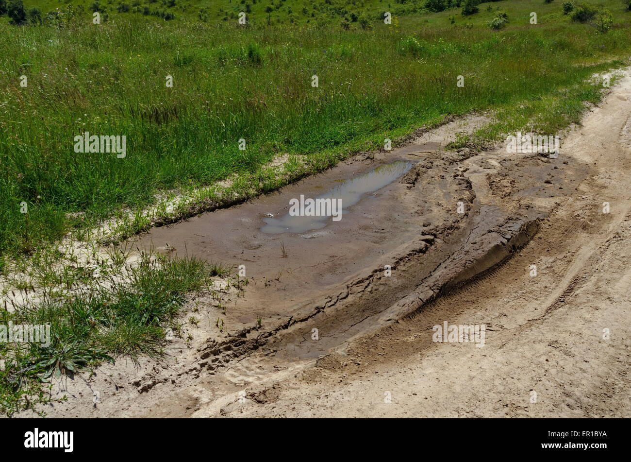 Ground mountain road after rain Stock Photo - Alamy