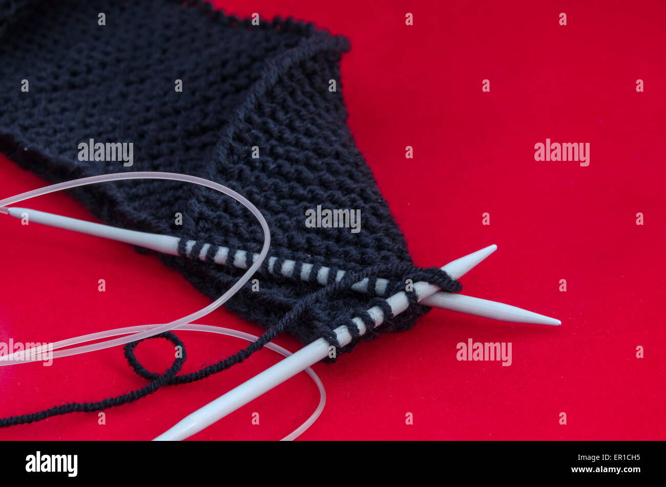 Close-up of hands knitting Stock Photo - Alamy