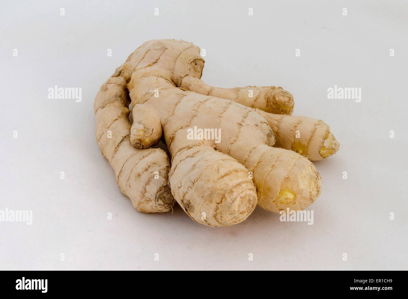 Fresh ginger root sliced on white background Stock Photo - Alamy