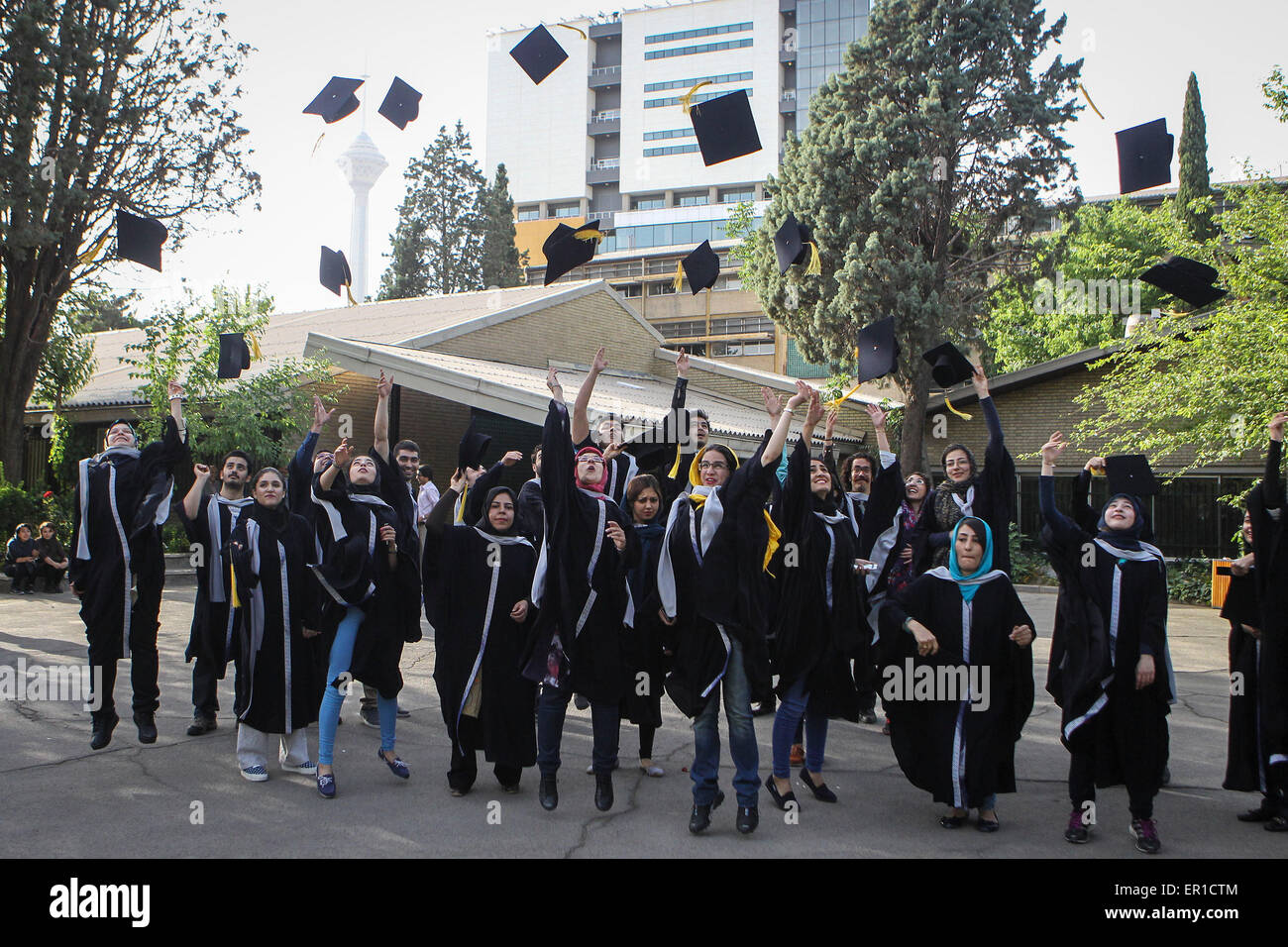 Tehran, Iran. 24th May, 2015. Iranian students throw their academic ...