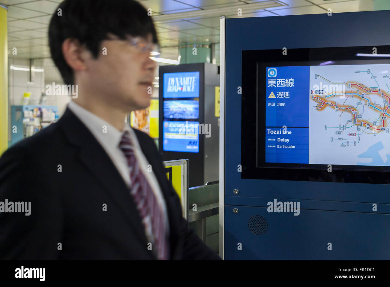A Tokyo Metro screen announces various train lines are delayed after an ...