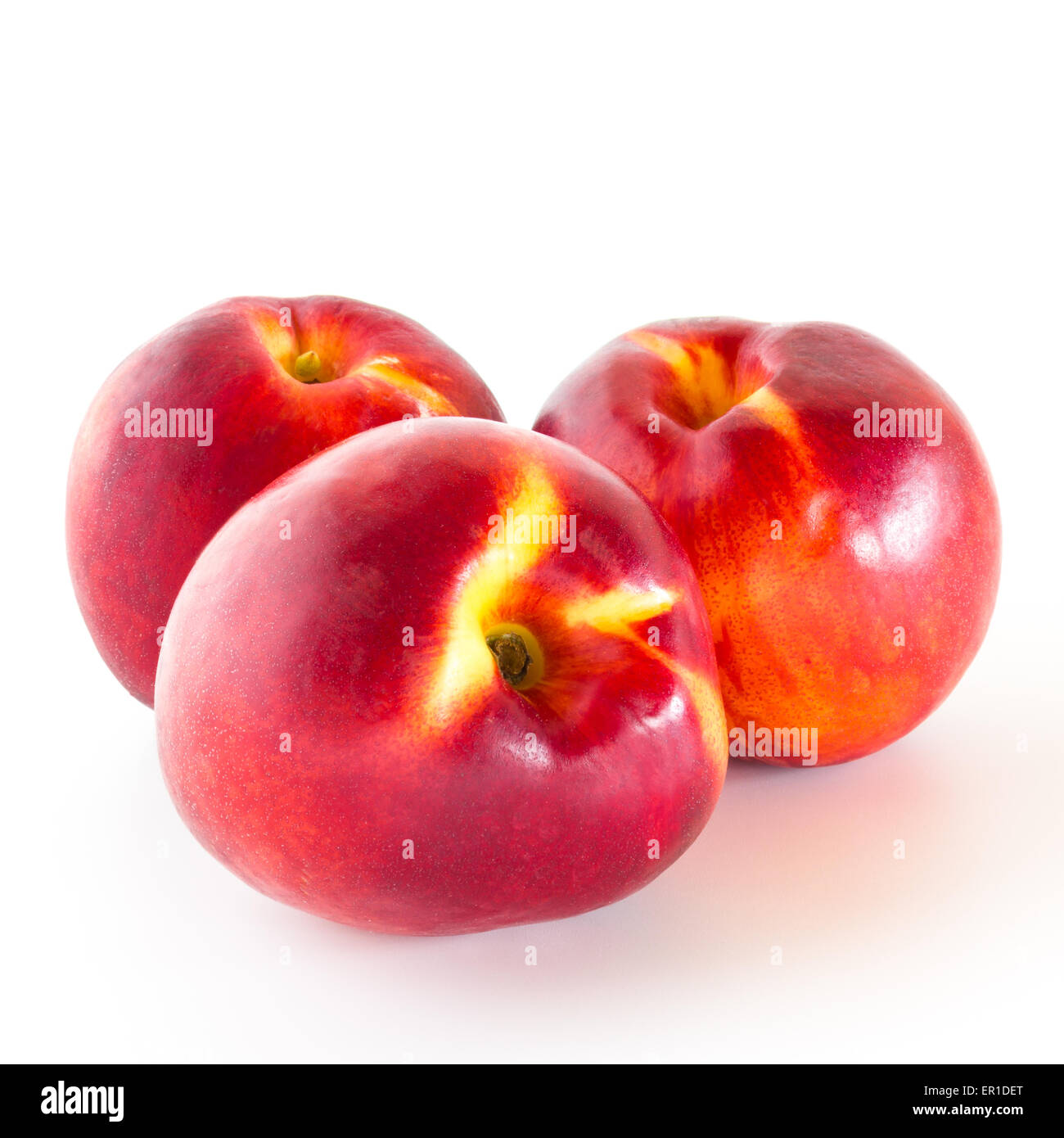 Group of three nectarines isolated on white background Stock Photo - Alamy