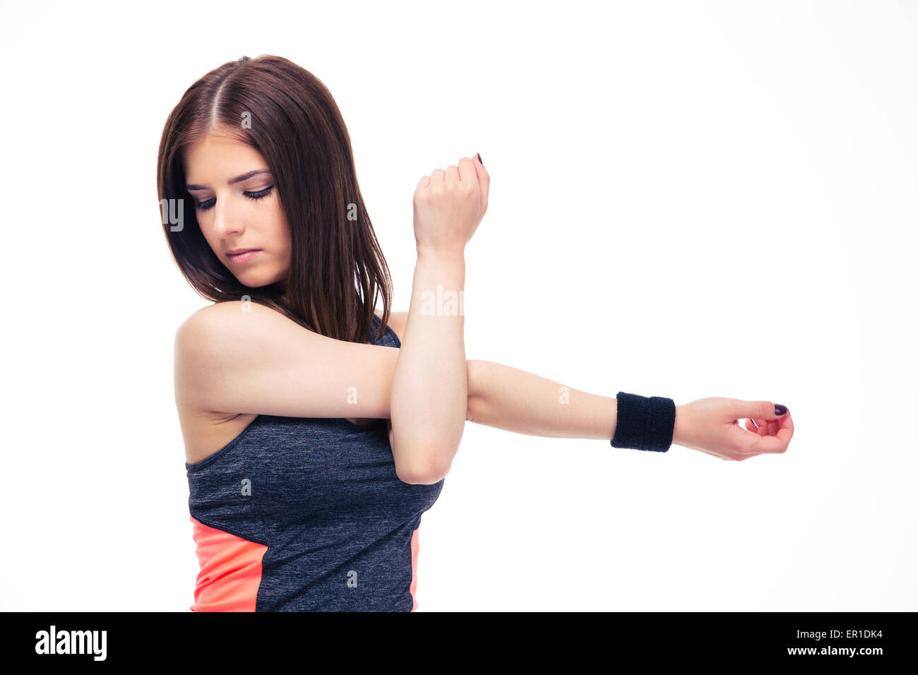 Pretty fitness woman stretching hands isolated on a white background ...
