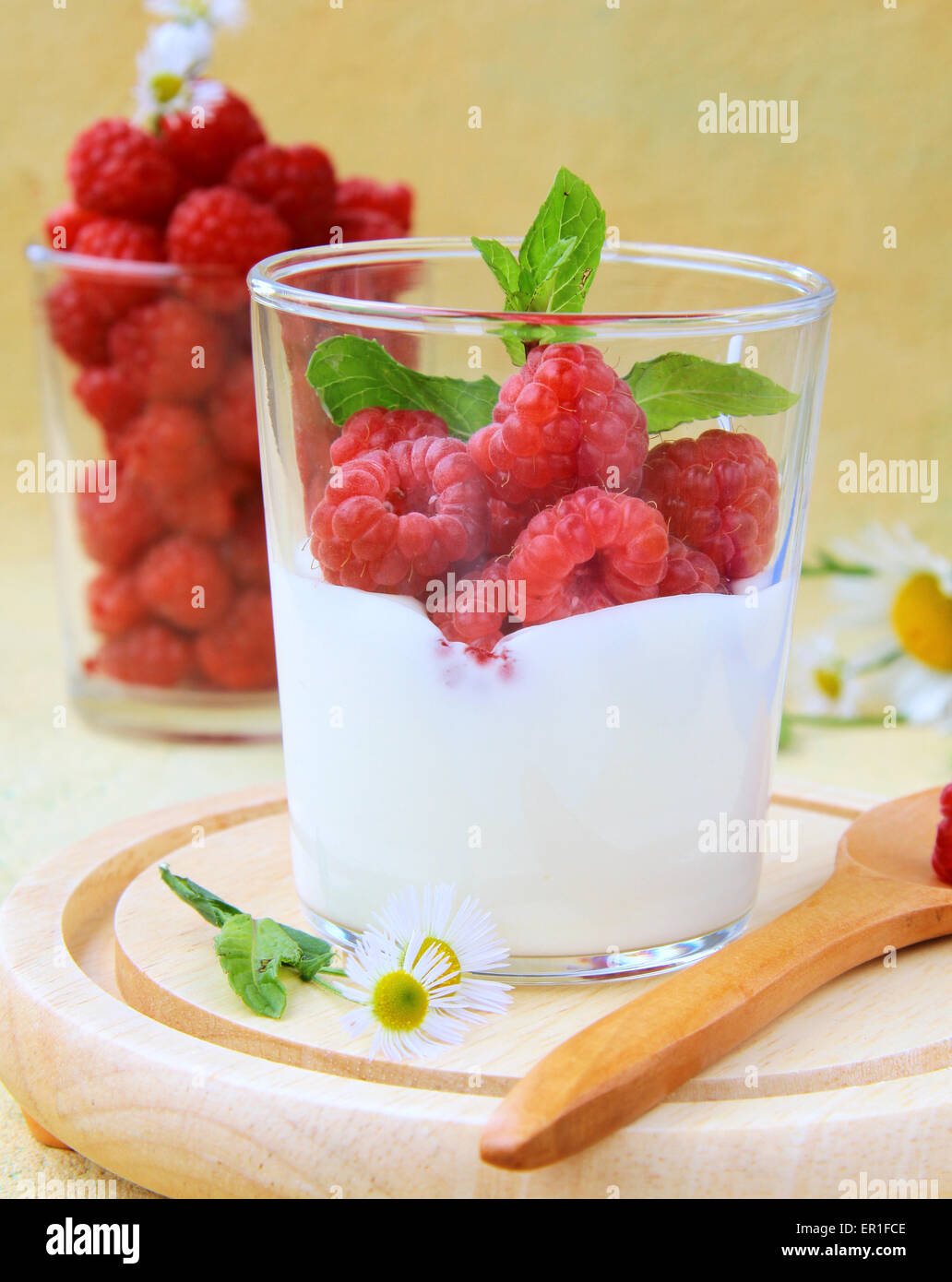 Dairy dessert - yogurt with fresh ripe red raspberries Stock Photo - Alamy