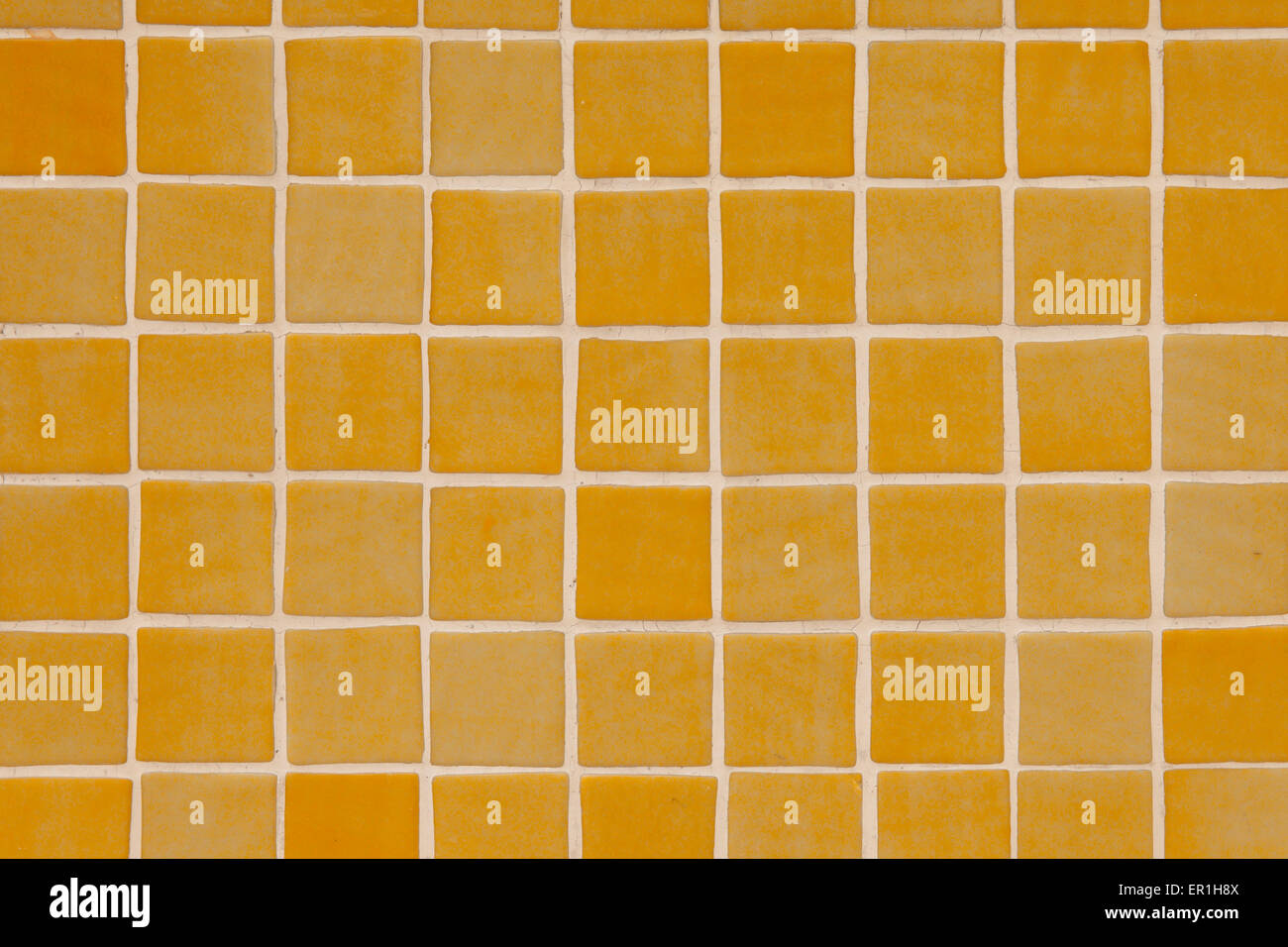 Detail of a yellow tiles wall Stock Photo - Alamy