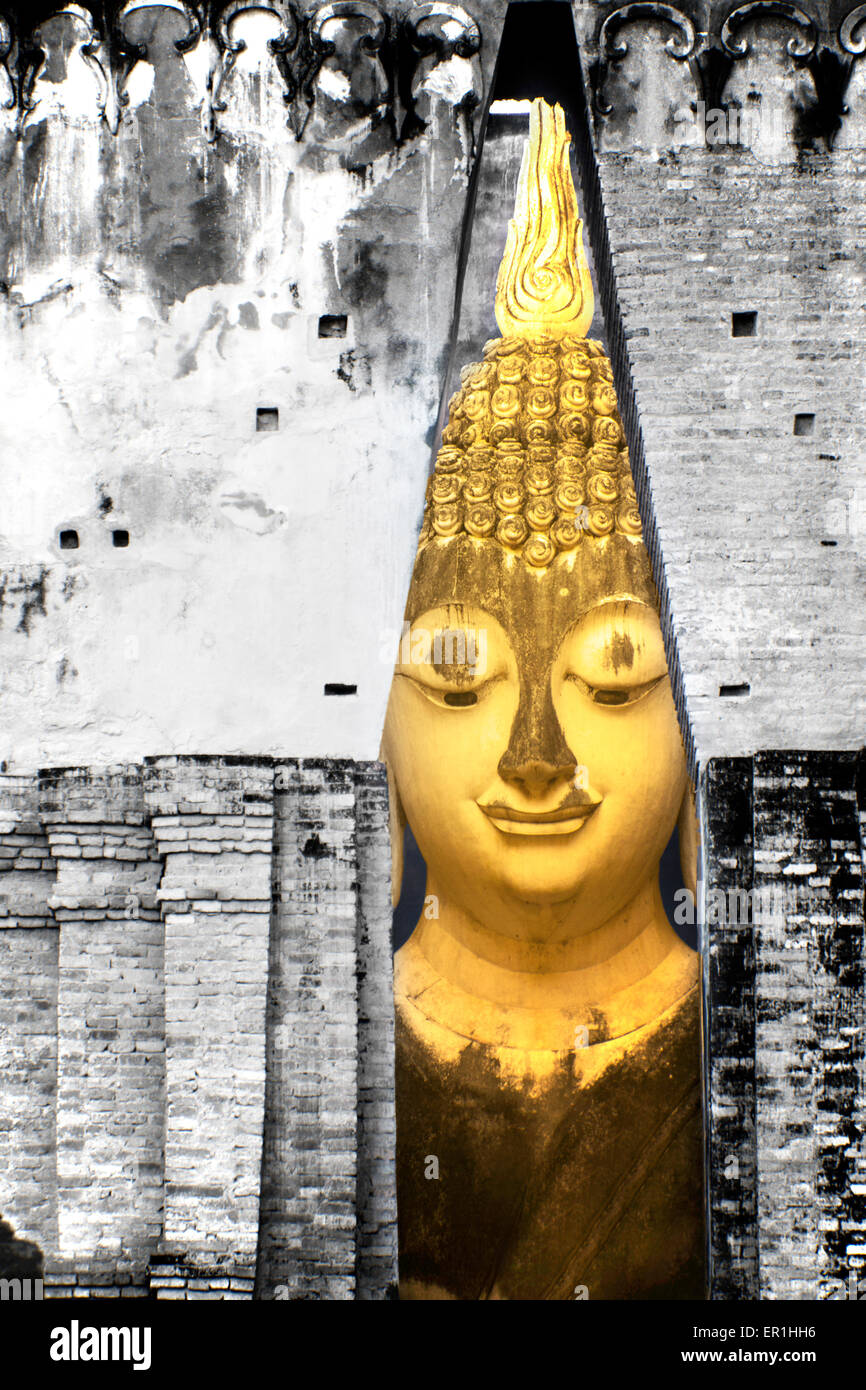 Golden monk in The wall Stock Photo - Alamy