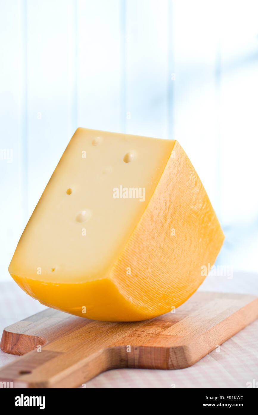 block of edam cheese on kitchen table Stock Photo - Alamy