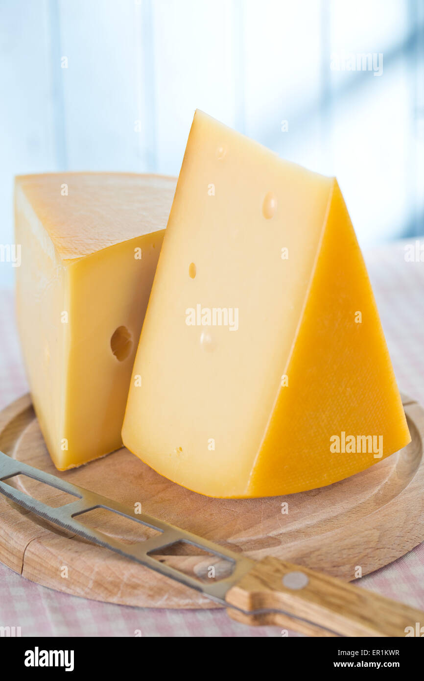 block of edam cheese on kitchen table Stock Photo - Alamy