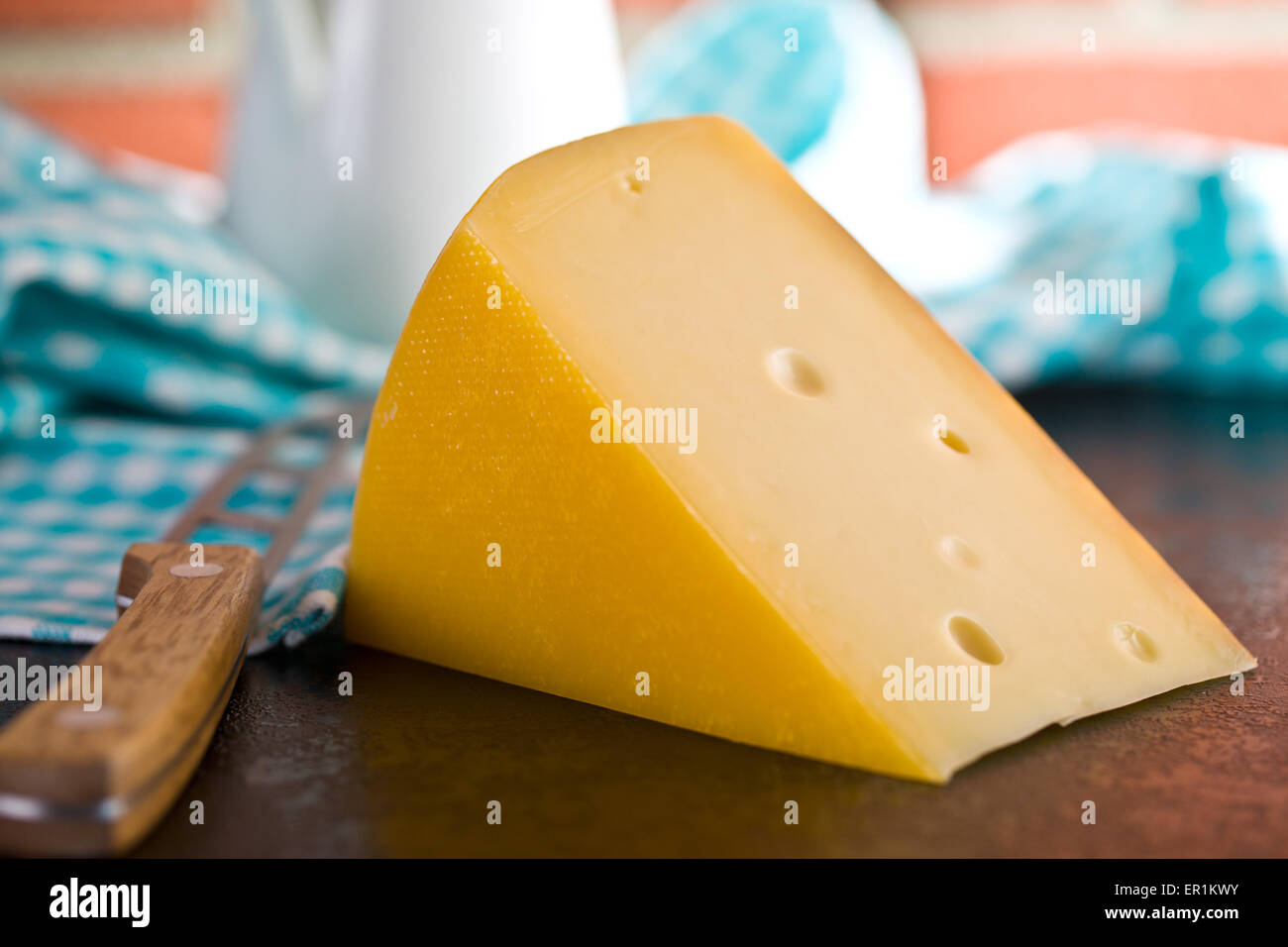 block of edam cheese on kitchen table Stock Photo - Alamy