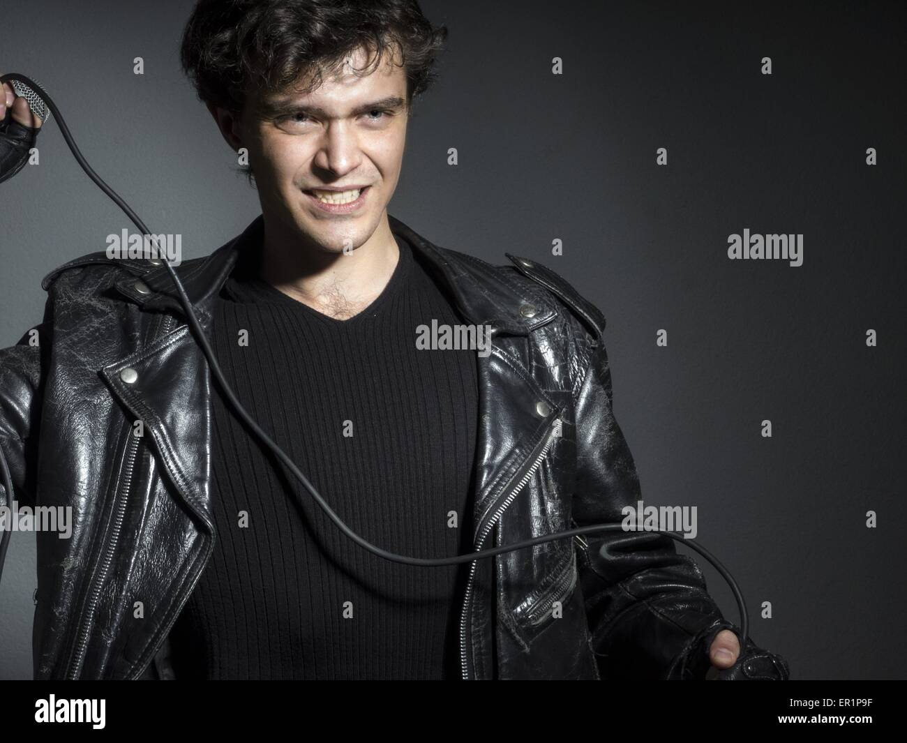 Rock singer screaming on the microphone. 21st Feb, 2014. © Igor ...