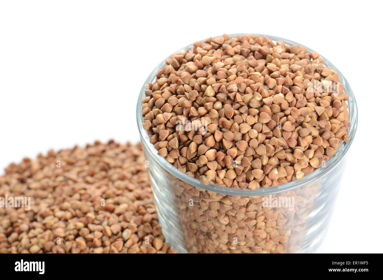 heap of buckwheat and glass isolated on white Stock Photo - Alamy