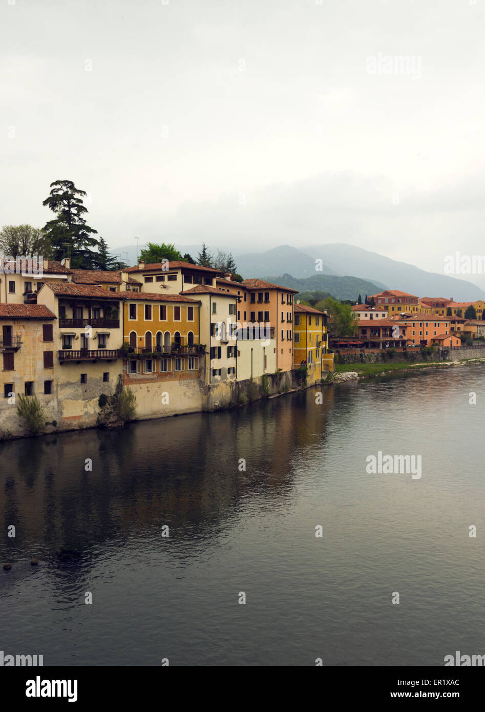 view of old houses and hills. Italian village Basano Del Grappa over ...