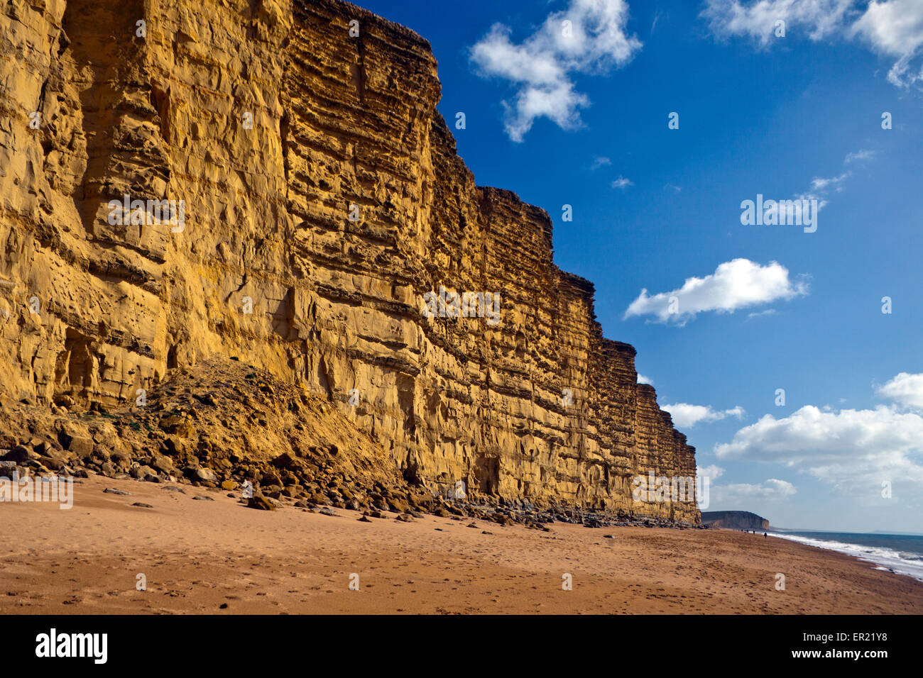 A cliff fall of the distinctive banded sandstone strata of East Cliff ...
