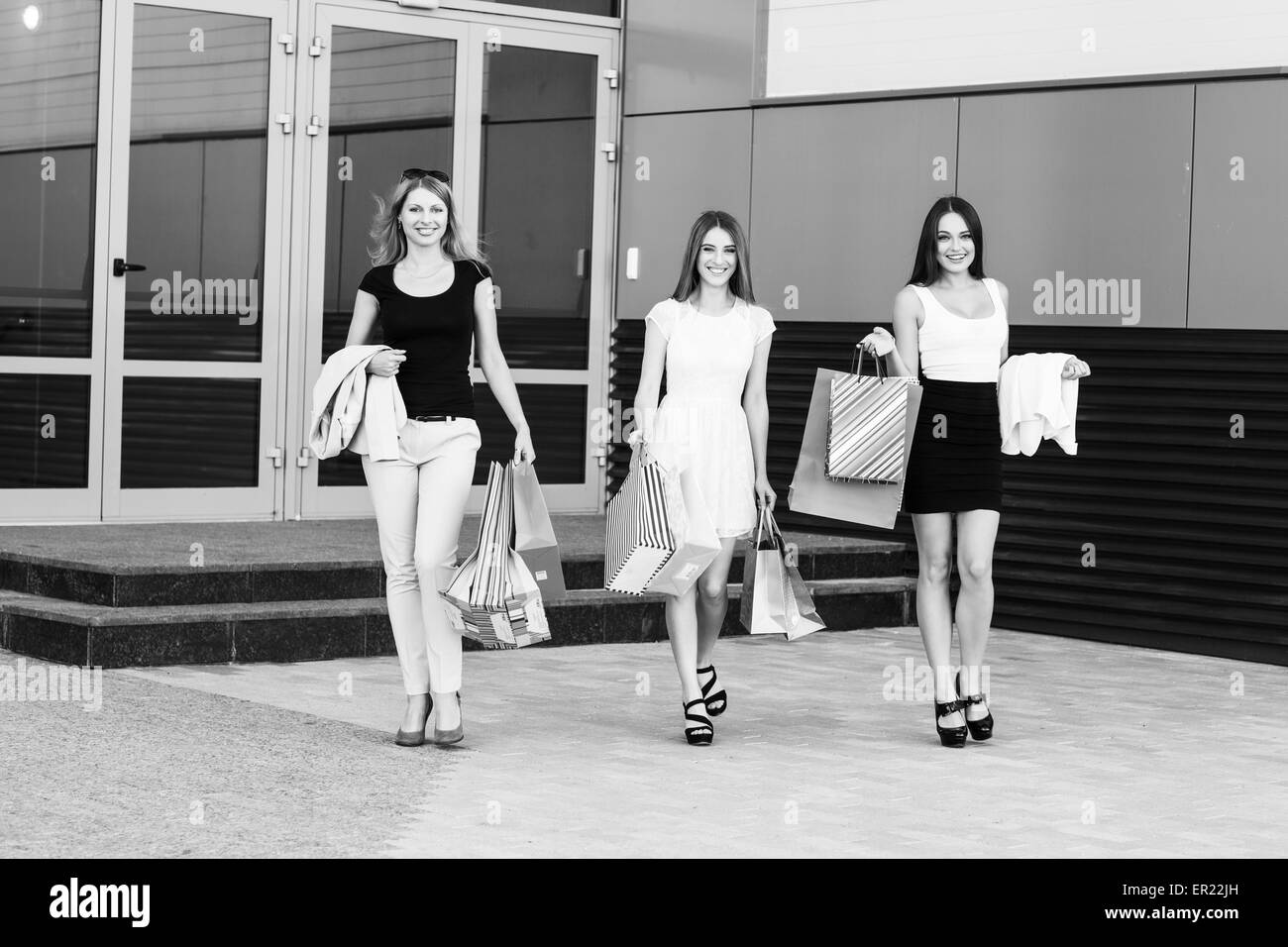 Young women after shopping Stock Photo - Alamy