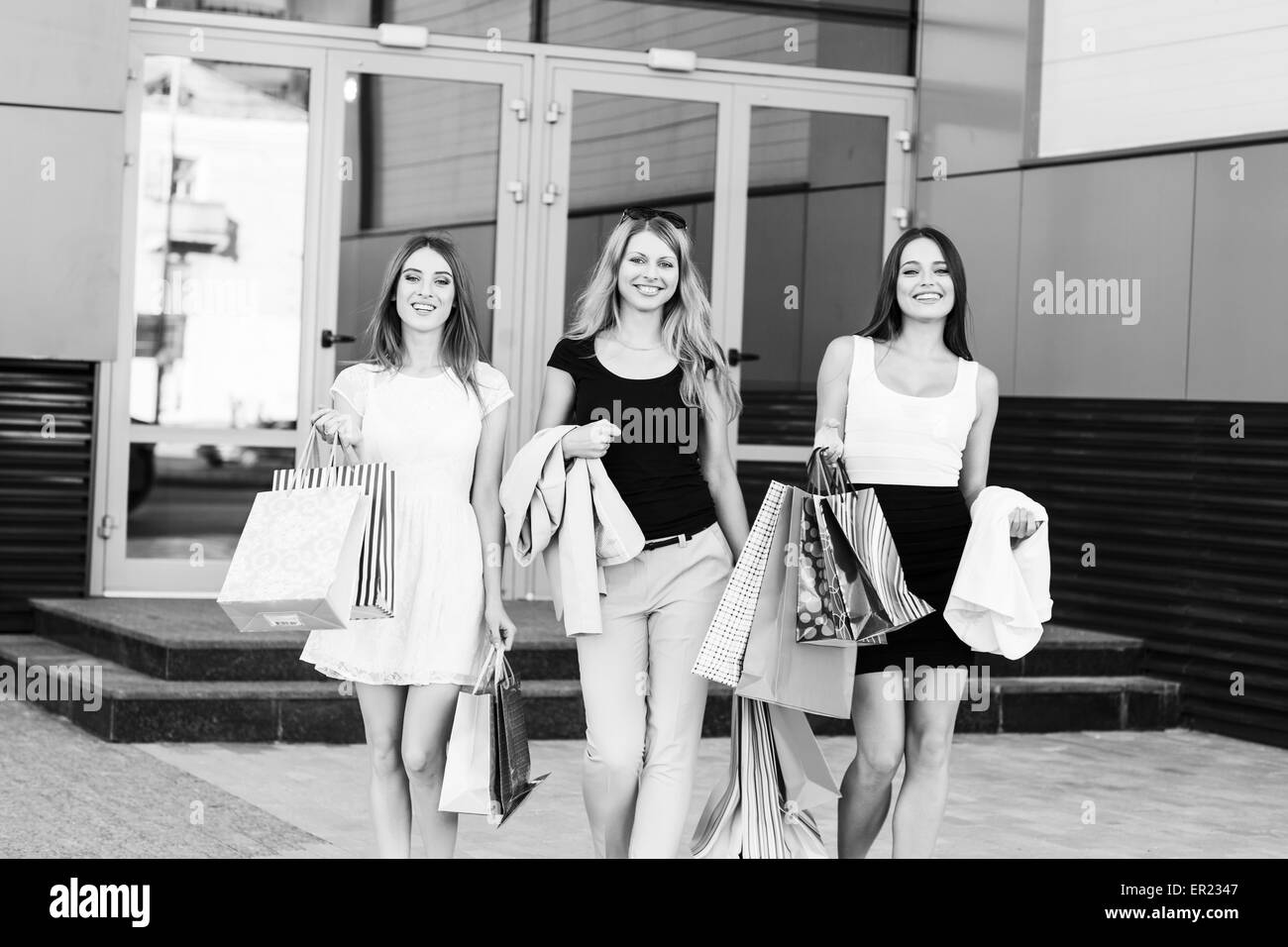 Young women after shopping Stock Photo - Alamy
