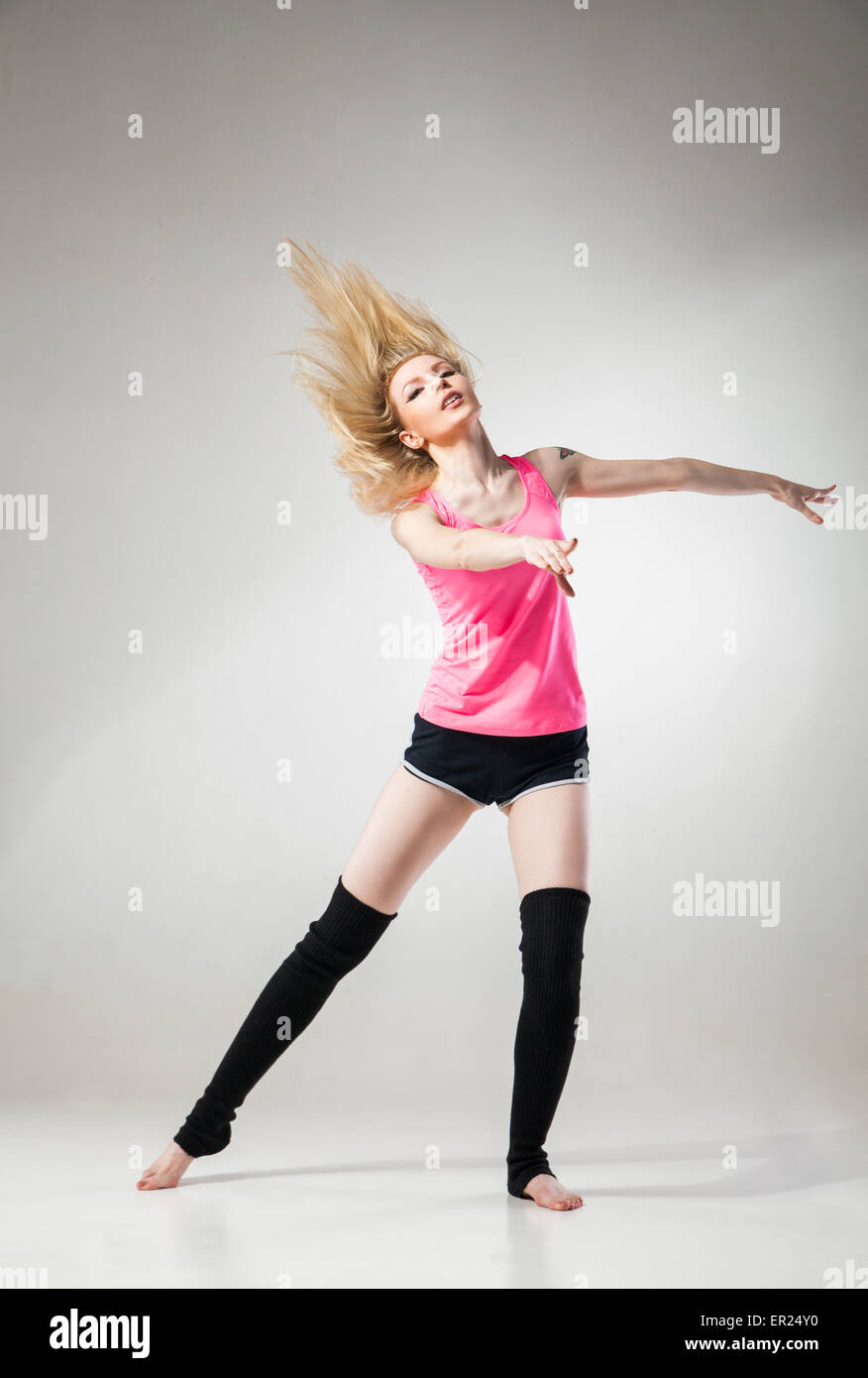 young beautiful dancer posing on white studio background Stock Photo ...