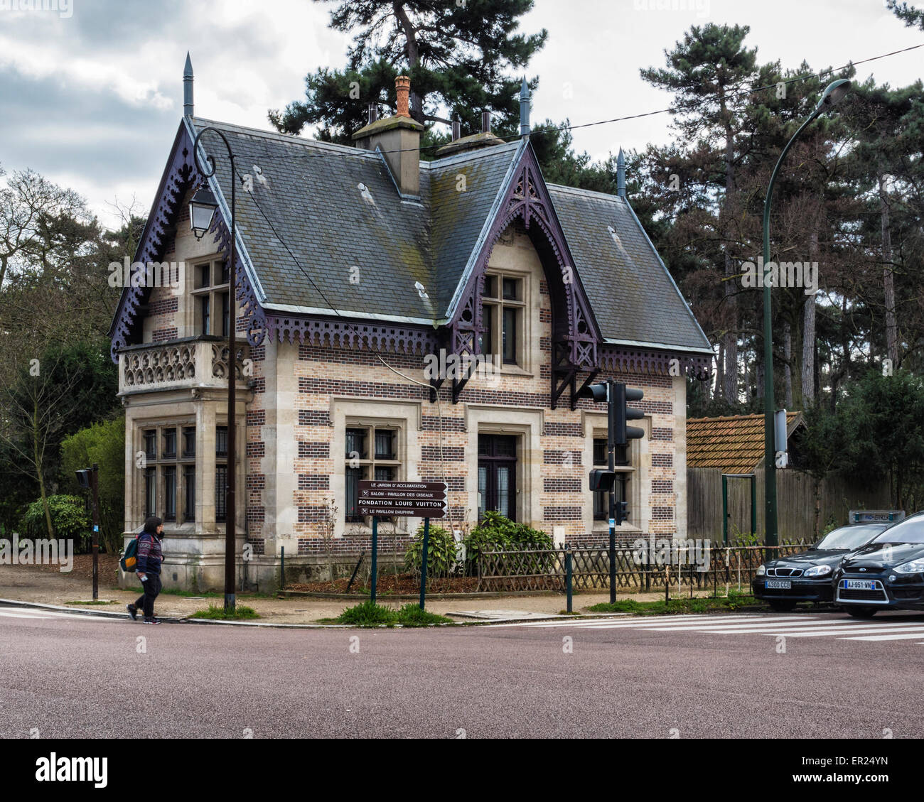 Attractive brick house with pitched tiled roof and ornate wood finishes ...