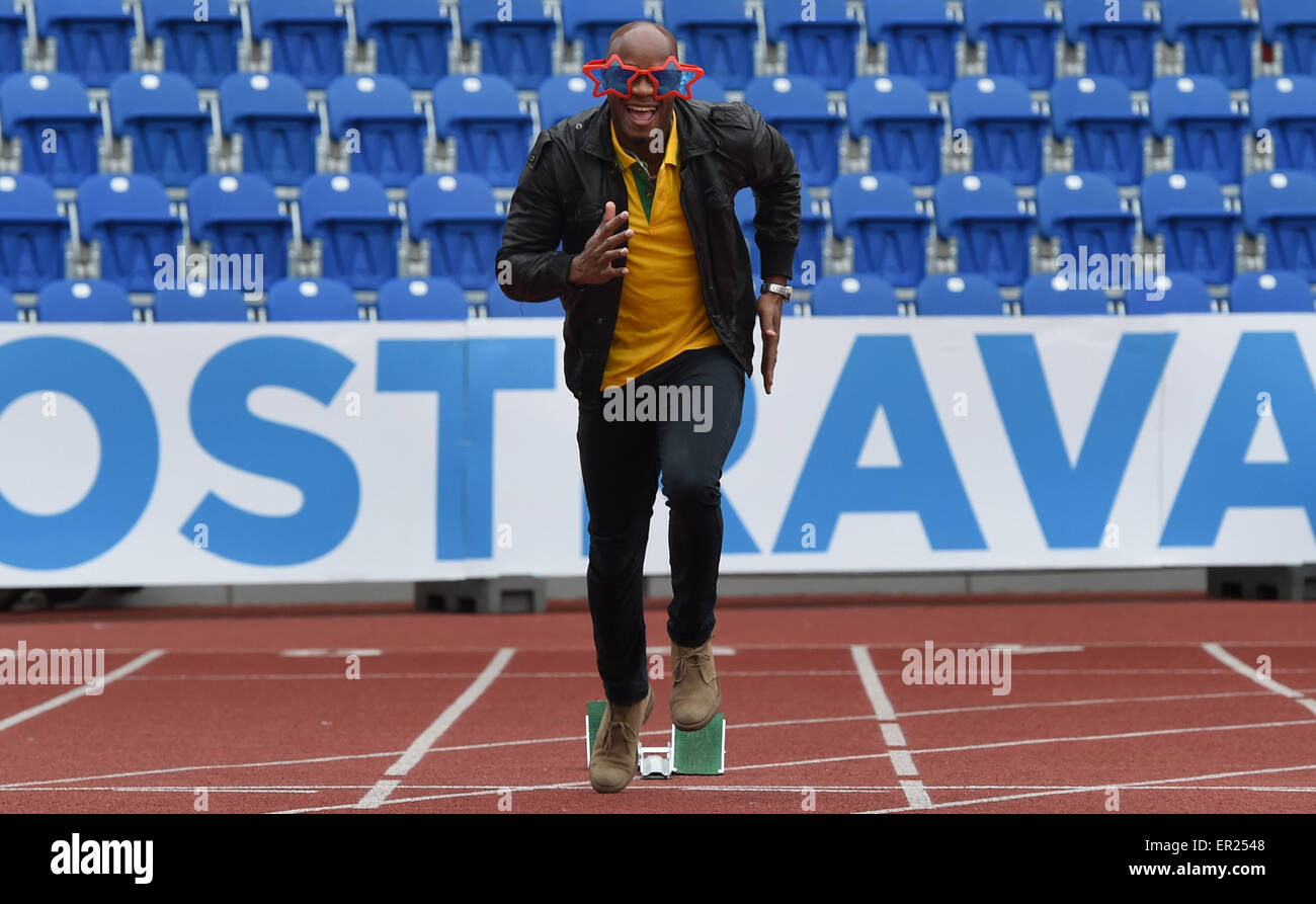 Jamaican sprinter Asafa Powell poses with funny glasses for media prior ...